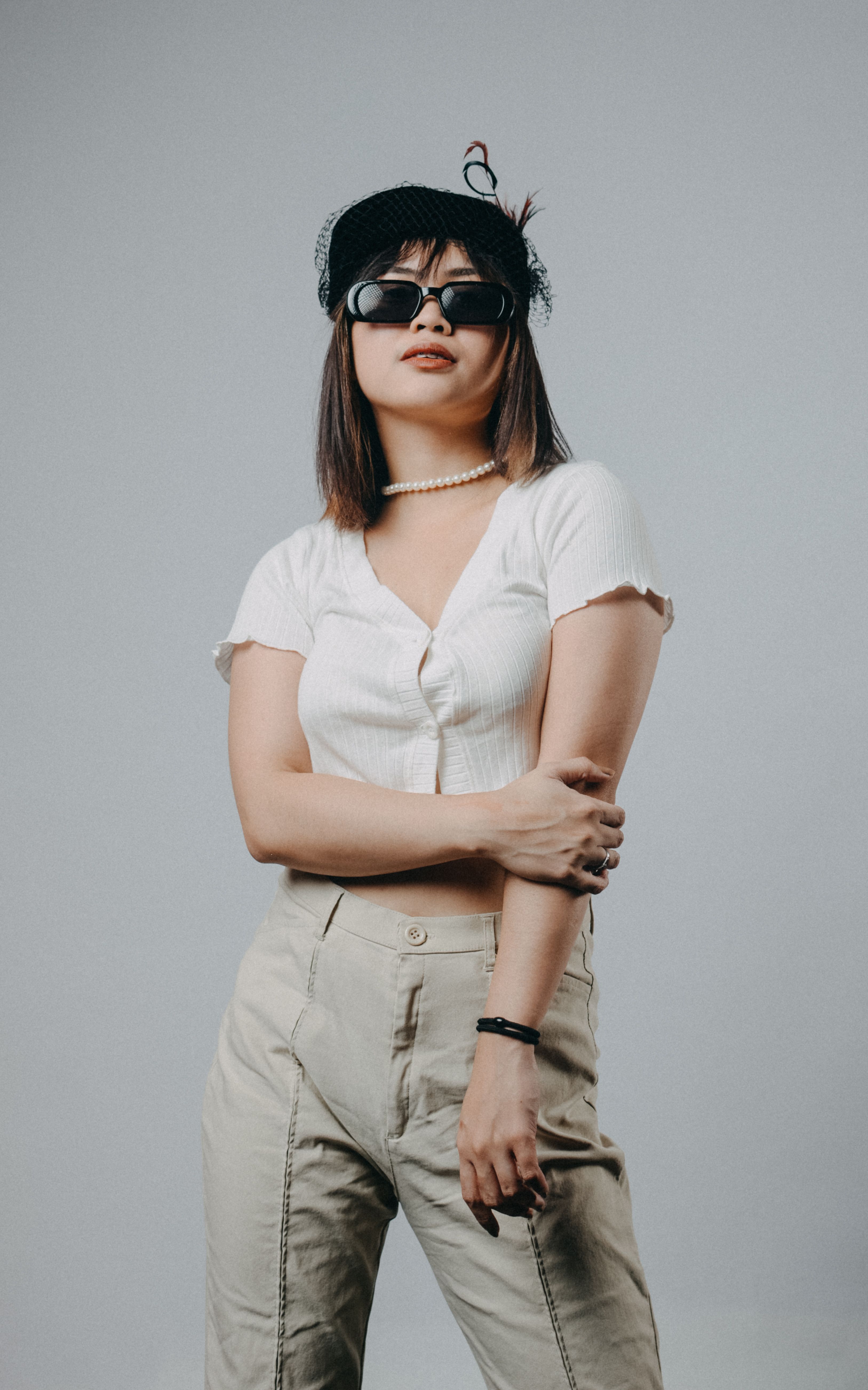 Woman Posing on White Background · Free Stock Photo