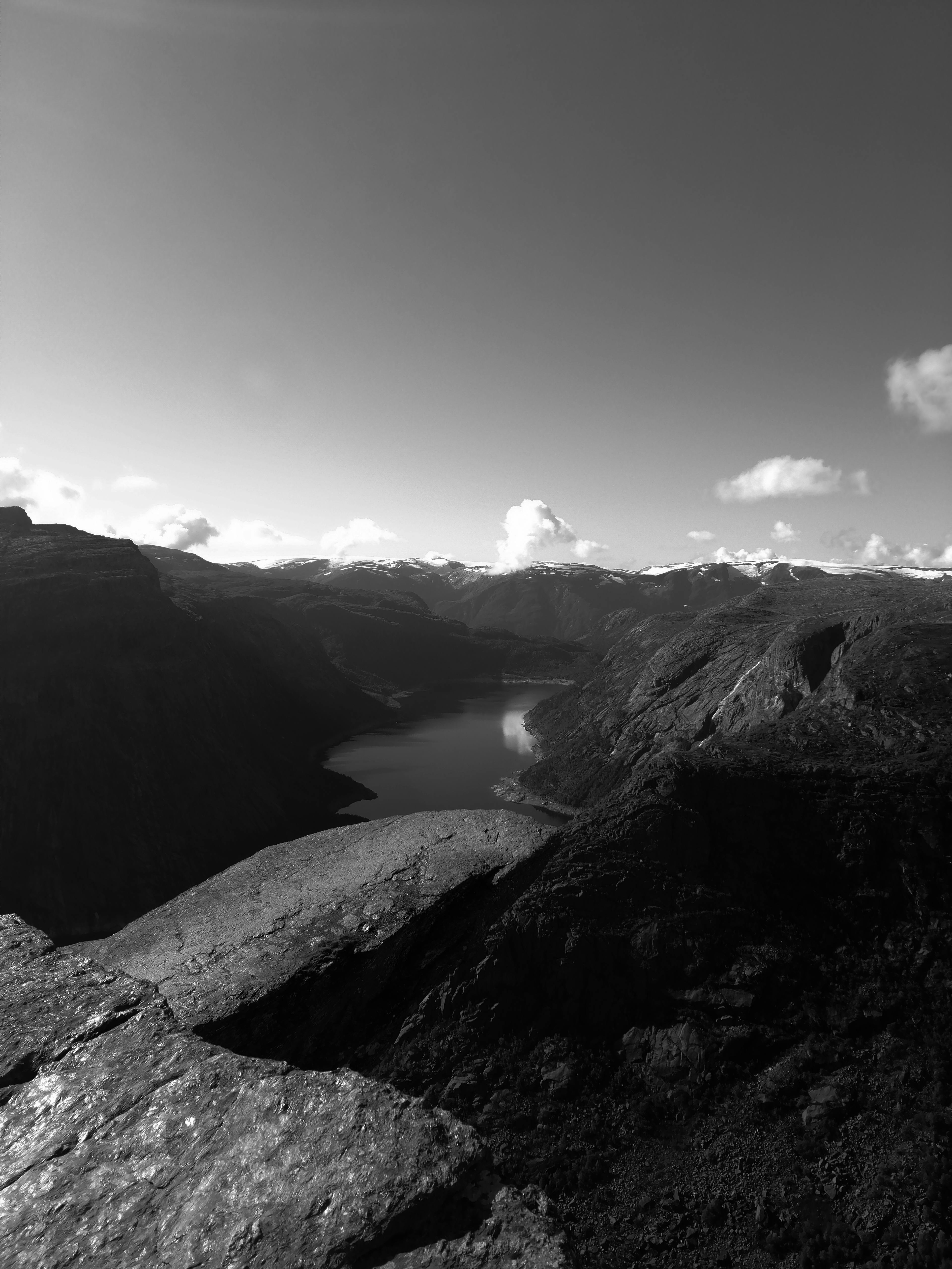 Grayscale Photo of Mountains and River · Free Stock Photo