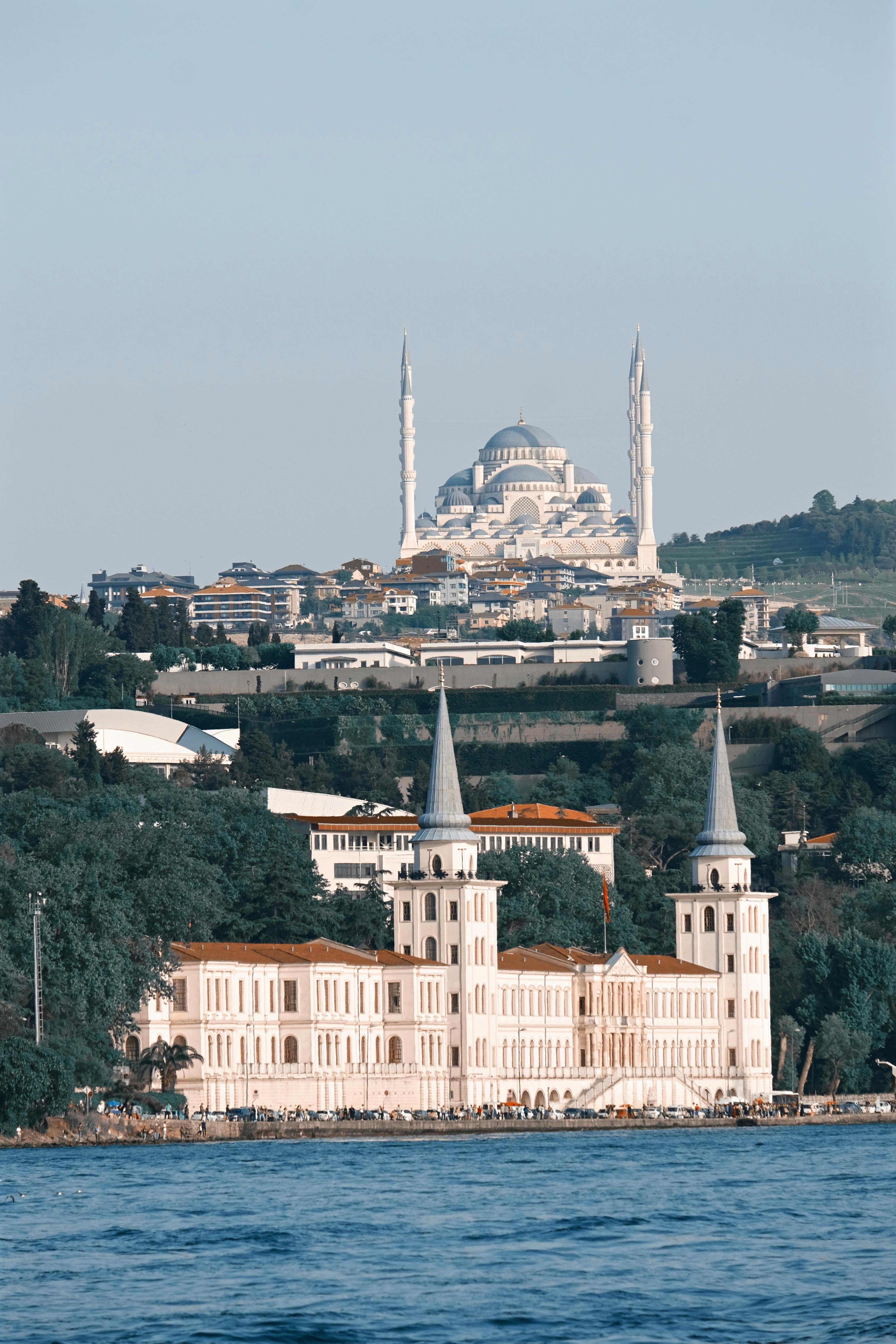 Concrete Buildings Beside the Ocean · Free Stock Photo