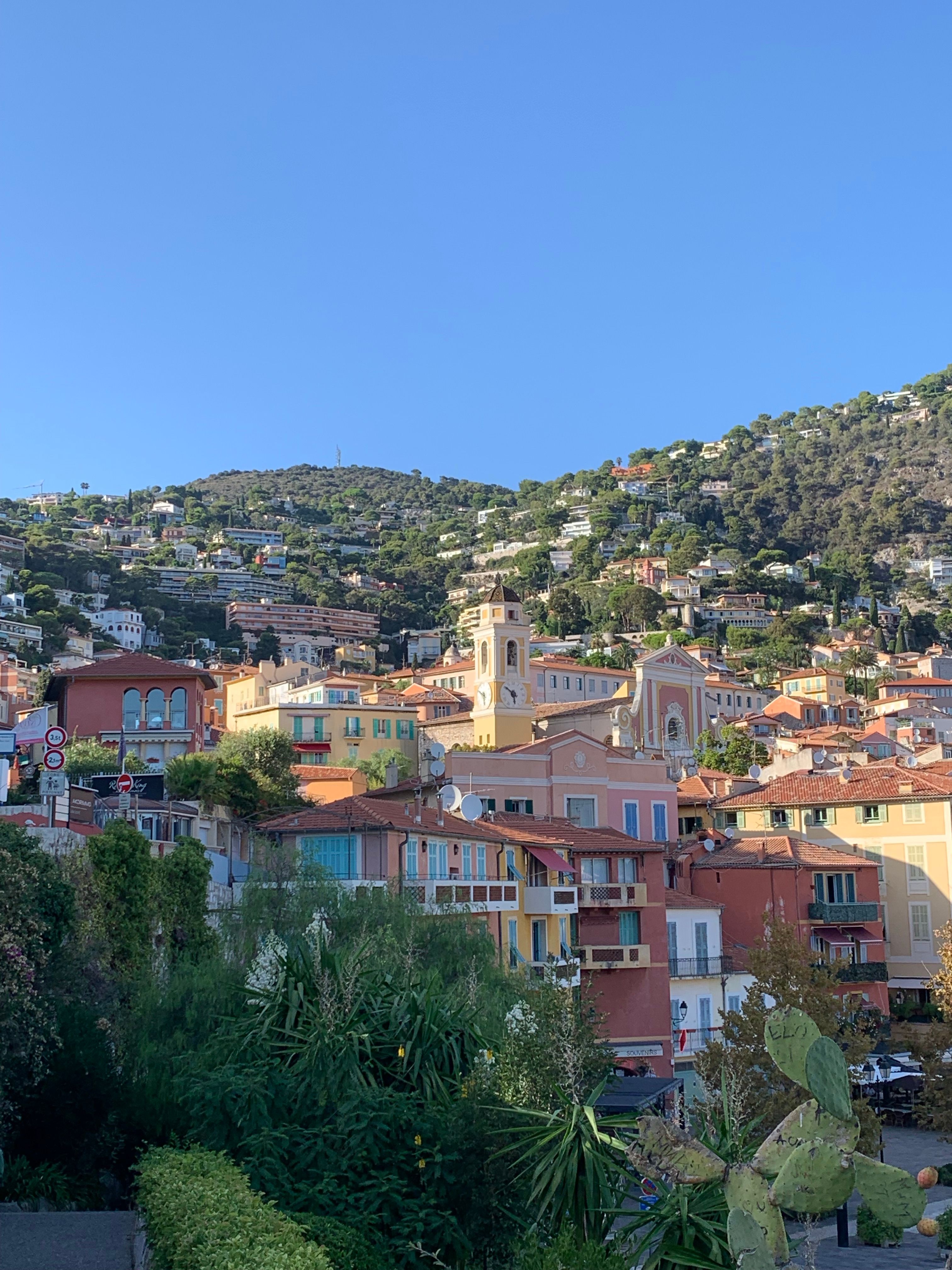Clear Sky Over Hillside Buildings Free Stock Photo