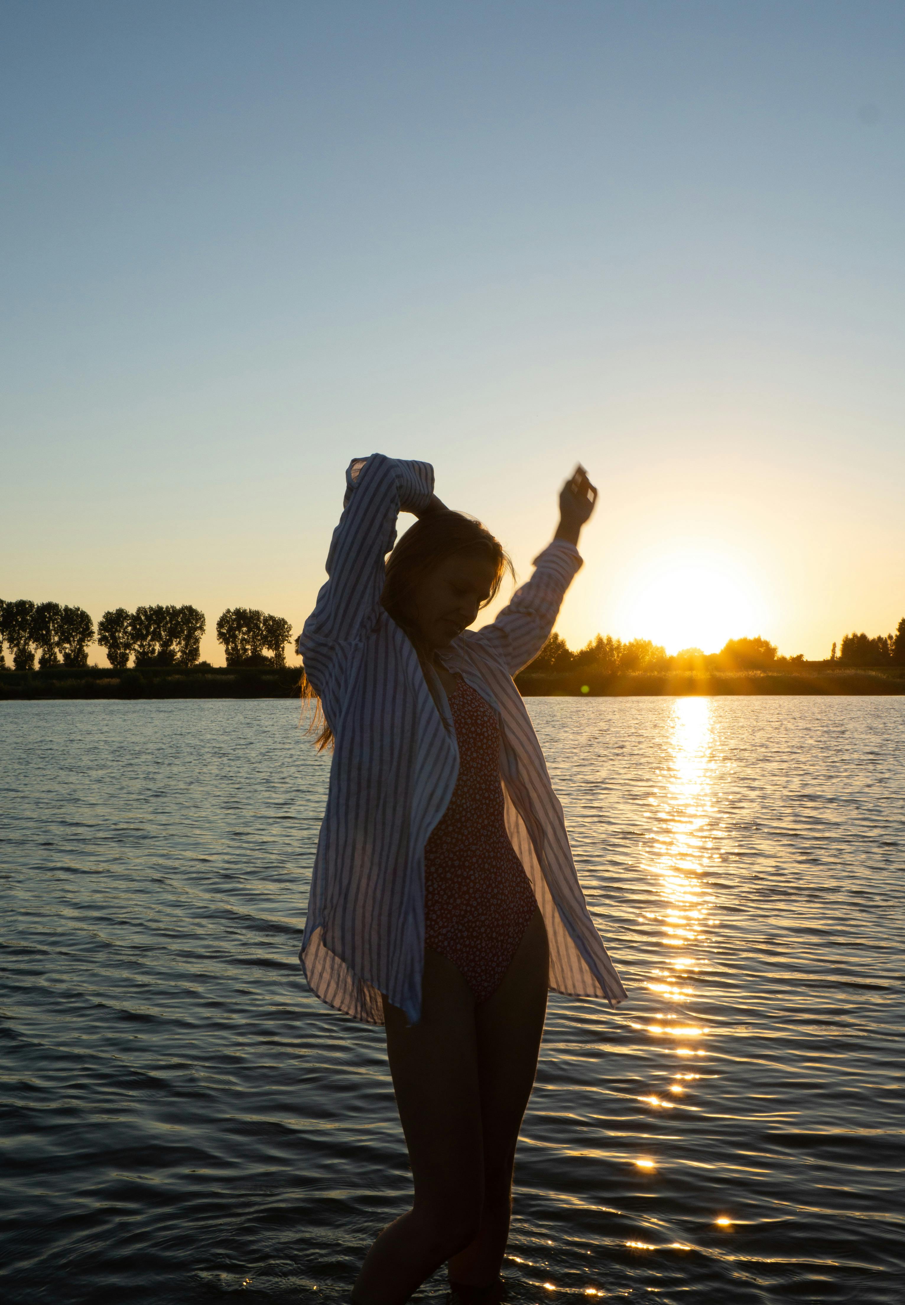 A Woman Standing on the Sea · Free Stock Photo