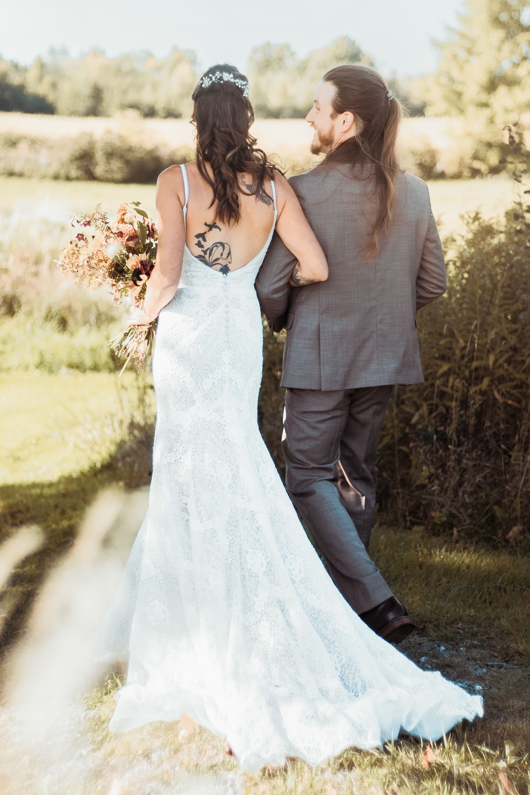 Back View of a Bride and Groom Walking Together · Free Stock Photo
