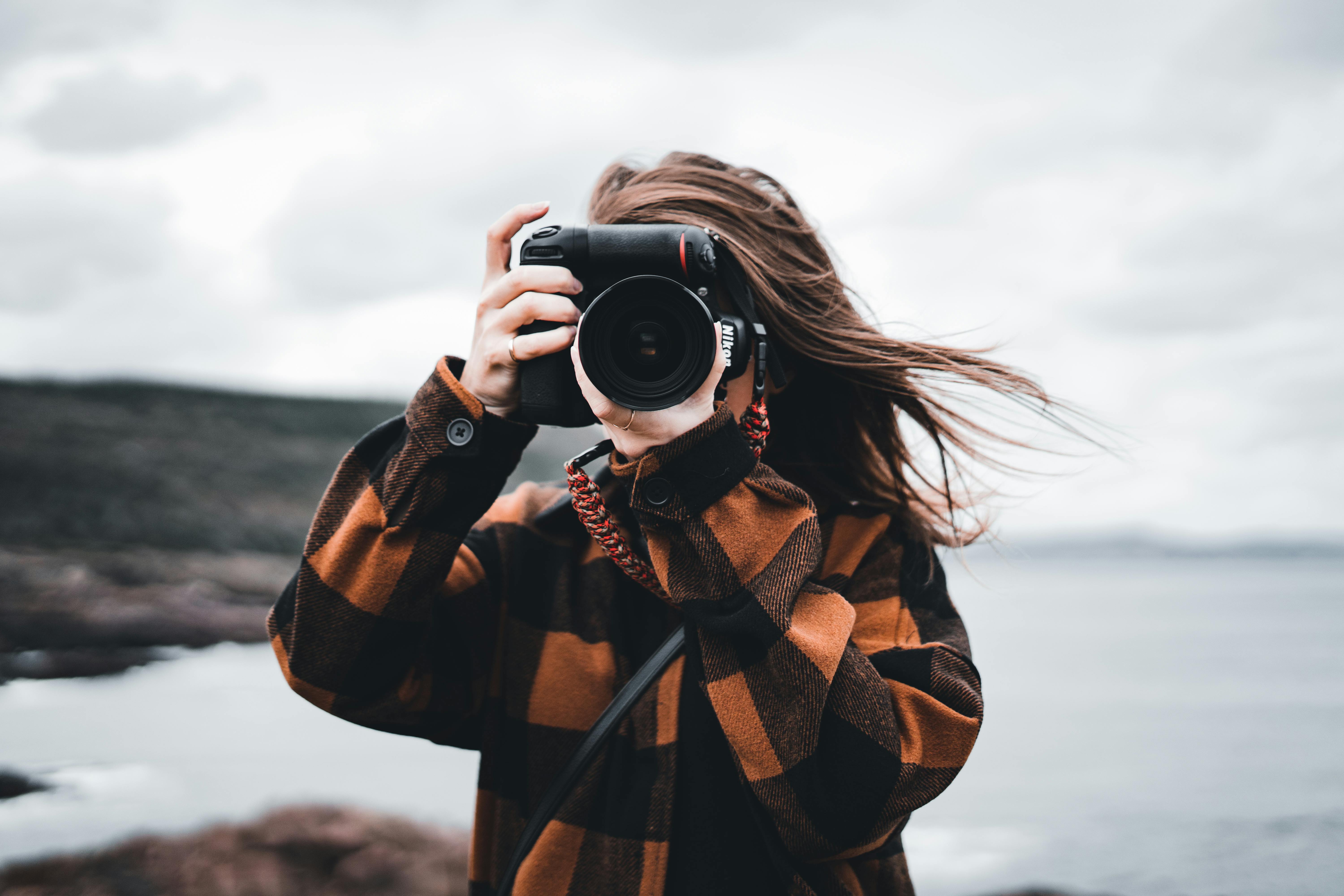 Woman Taking Picture with Camera · Free Stock Photo