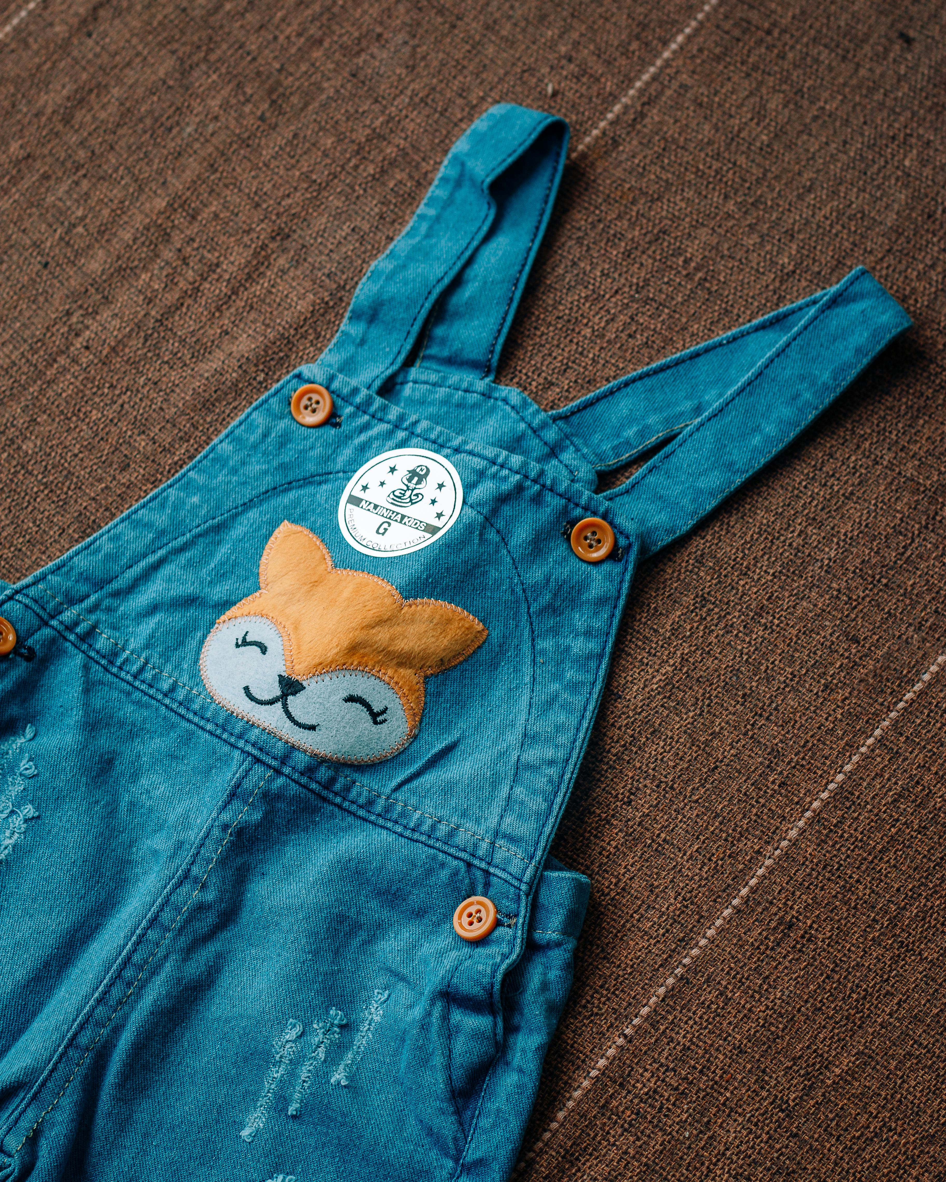 Cute Little Dungarees with a Picture of an Animal · Free Stock Photo