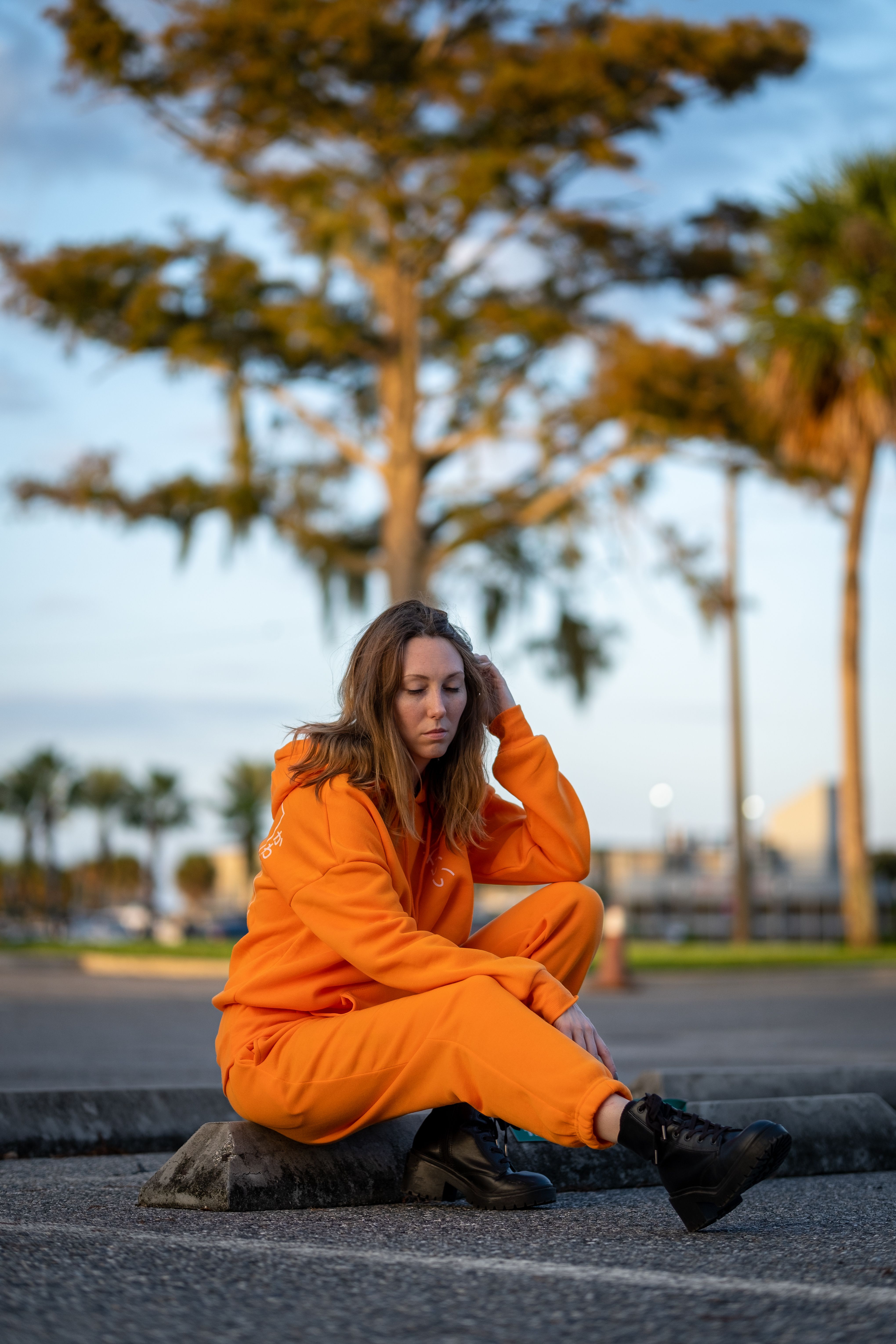 A Woman Wearing Orange Hoodie Jacket and Orange Jogger Pants · Free ...