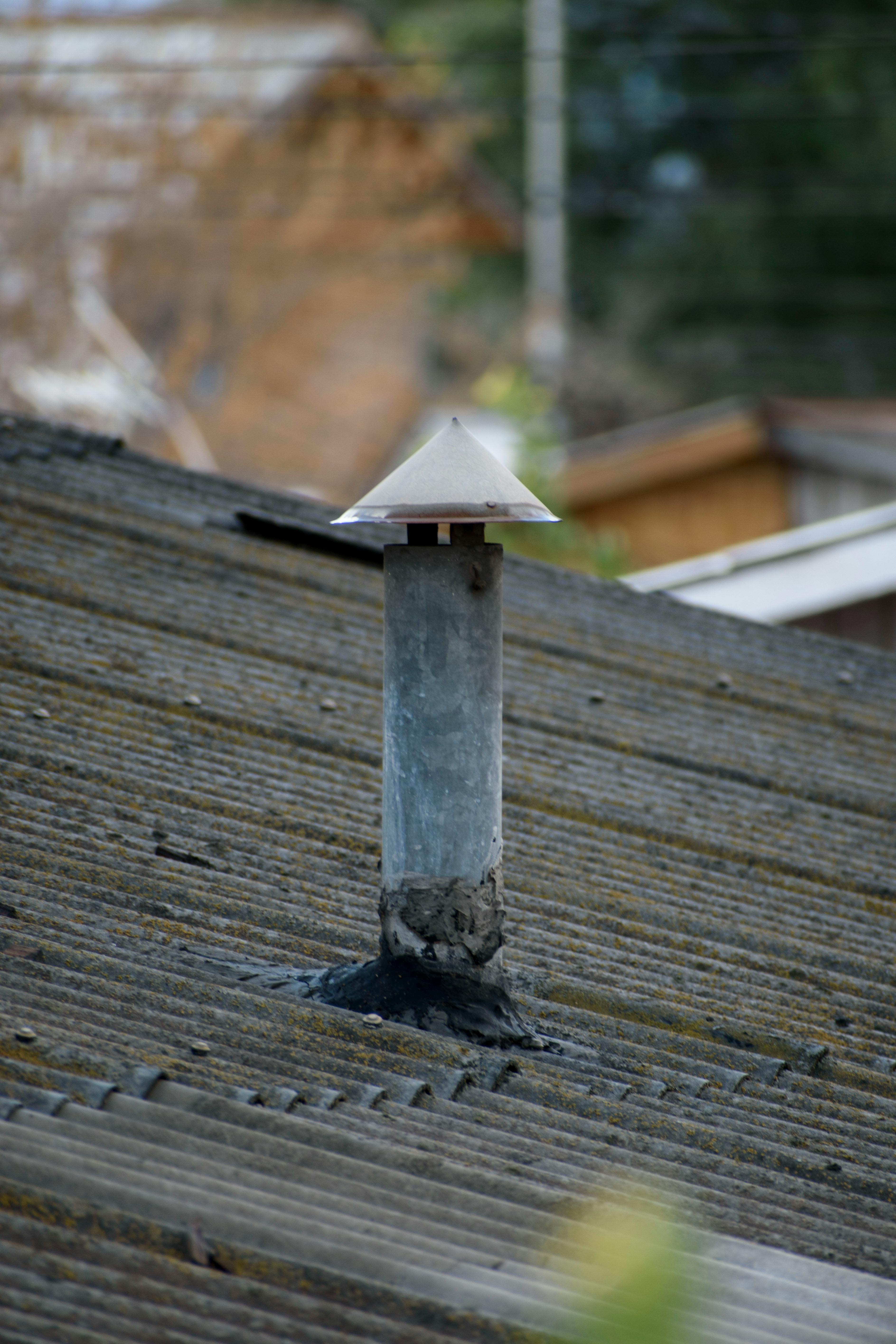 White Triangle House Roof with a Chimney · Free Stock Photo