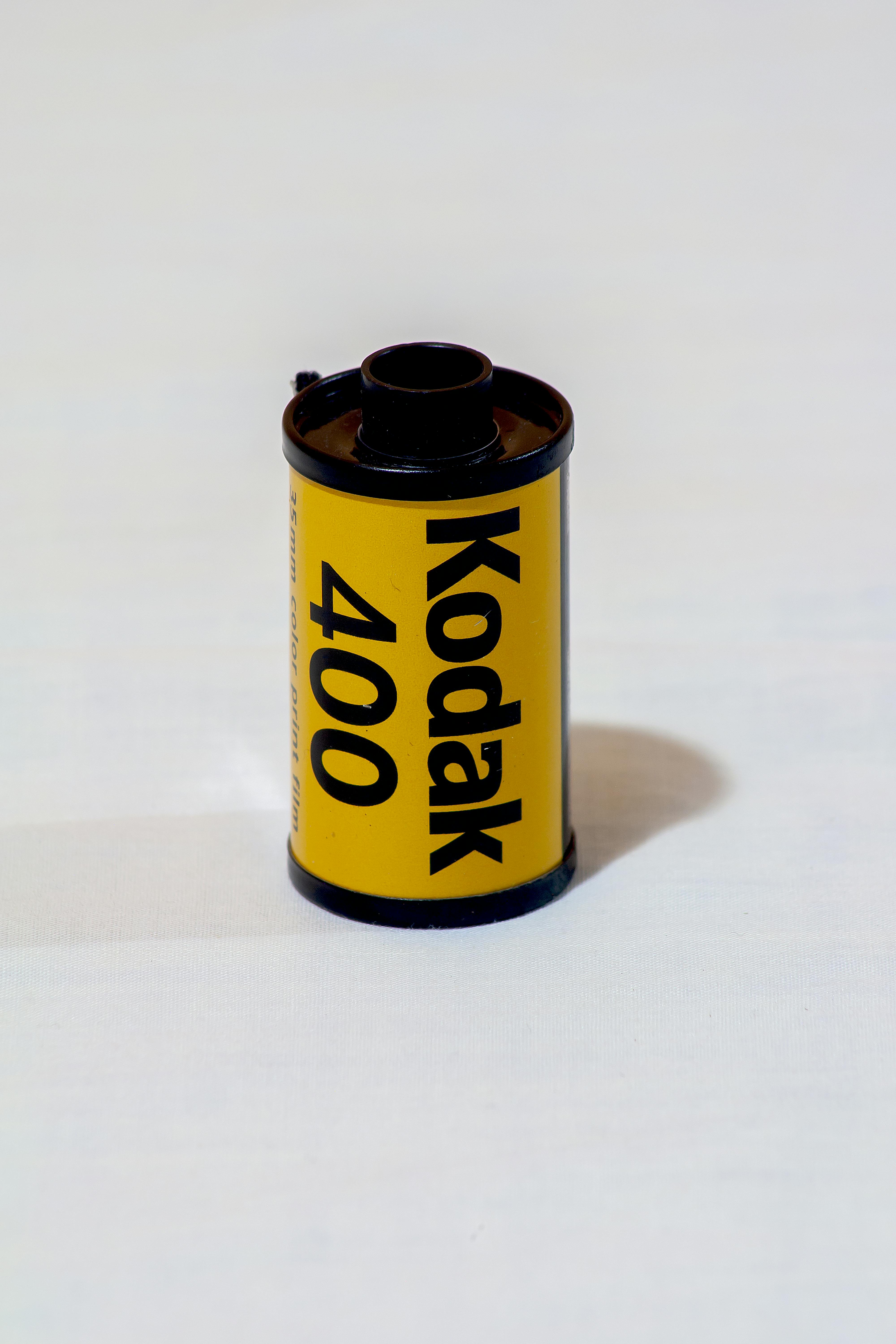 Camera On Black Folding Chair · Free Stock Photo