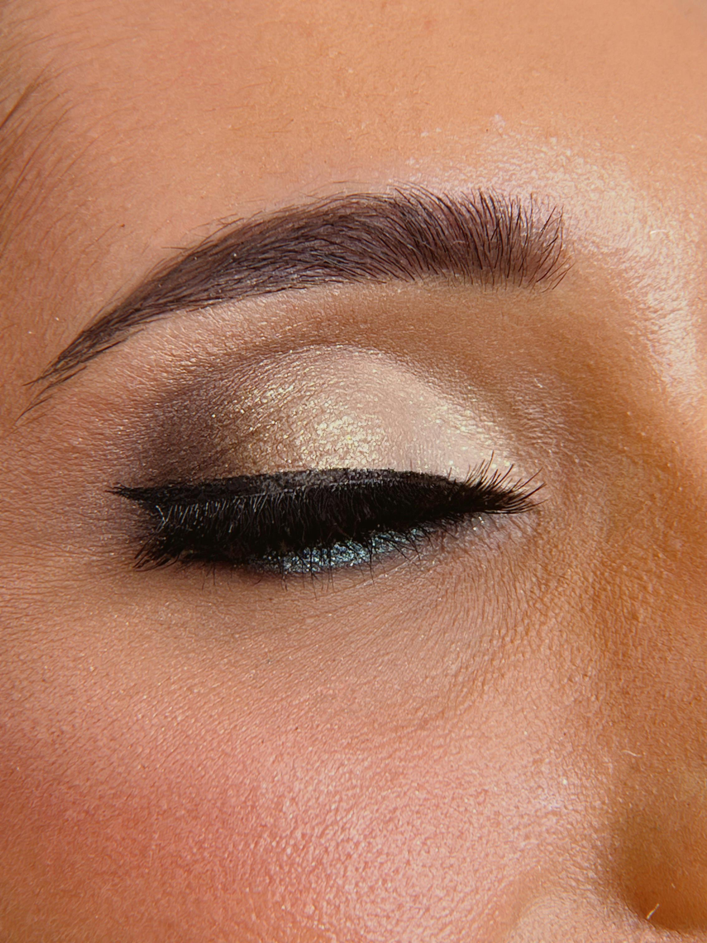 A Woman Applying Eyeshadow · Free Stock Photo