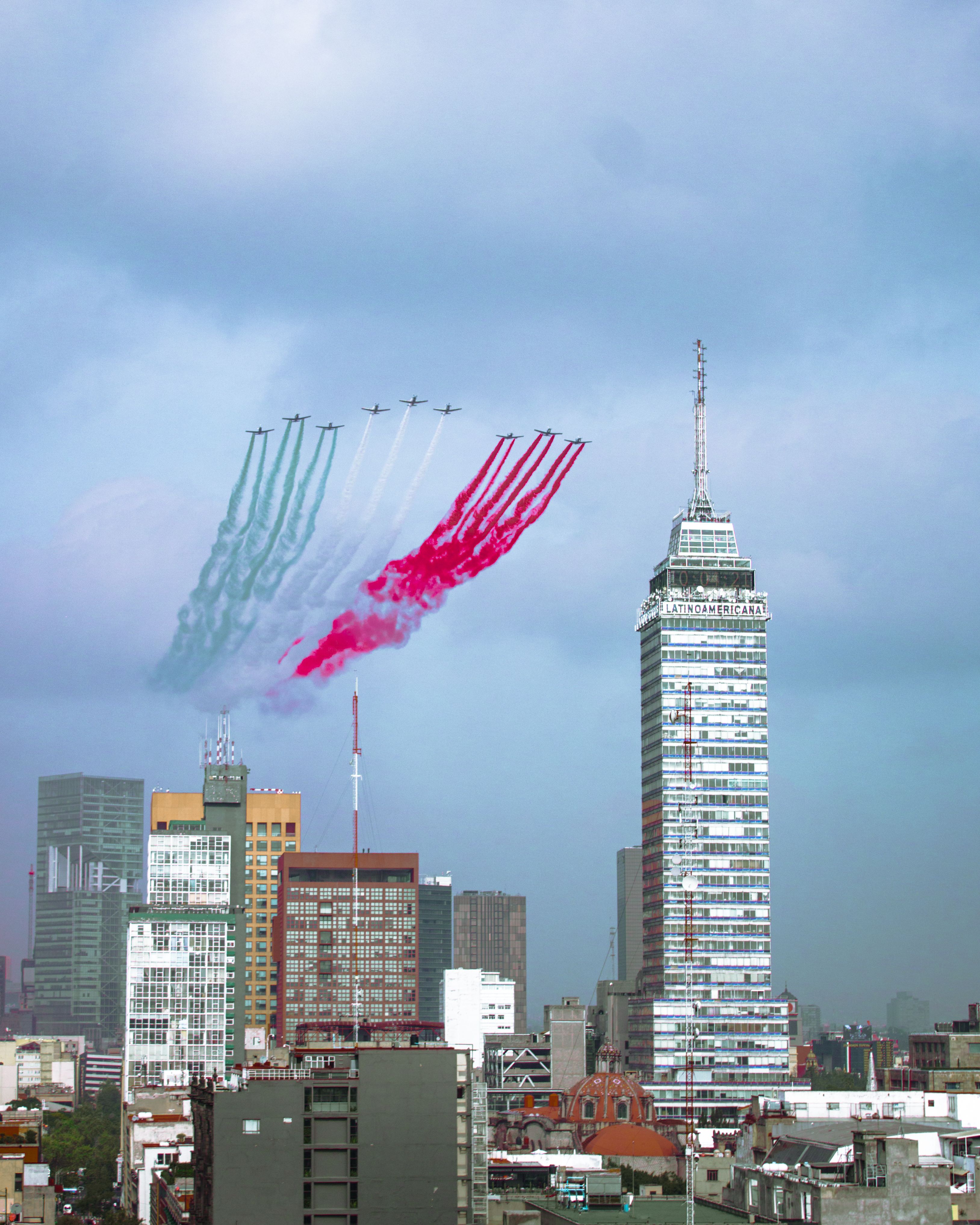 Airplanes Flying past Torre Latinoamericana Skyscraper in Mexico City ...