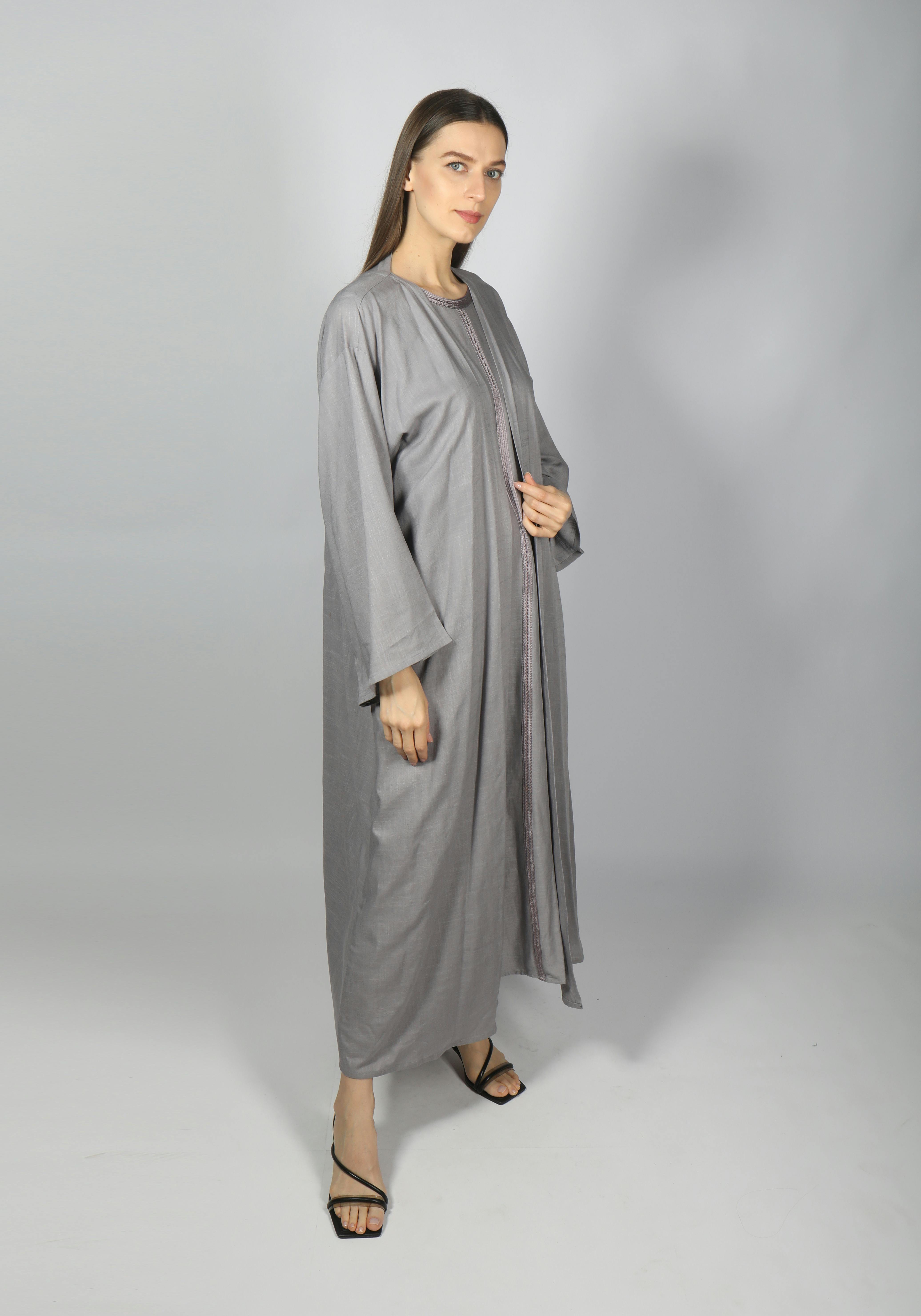 A Woman Wearing a Gray Cloak · Free Stock Photo