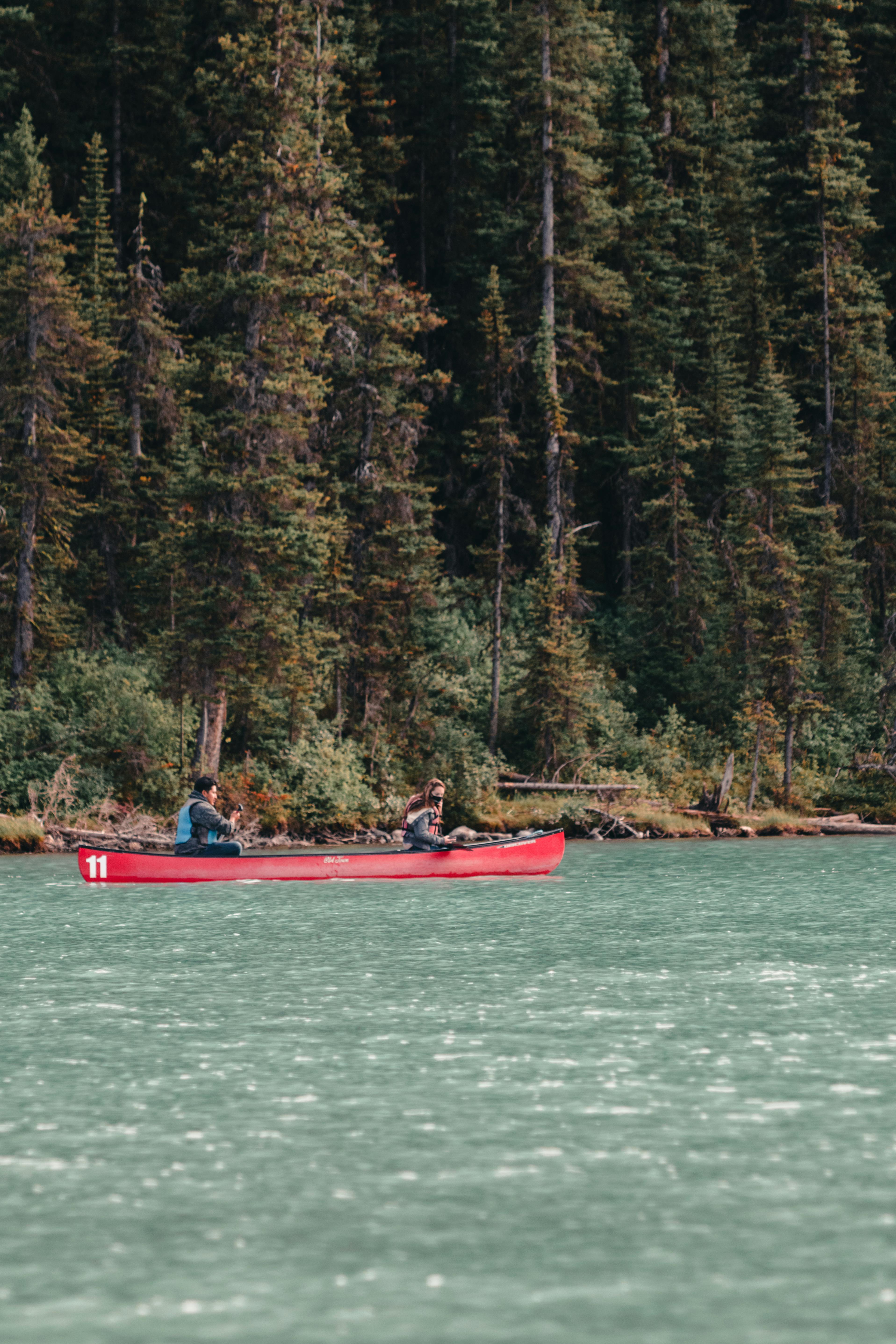 Bird's Eye View of Two People Canoeing on Body of Water · Free Stock Photo