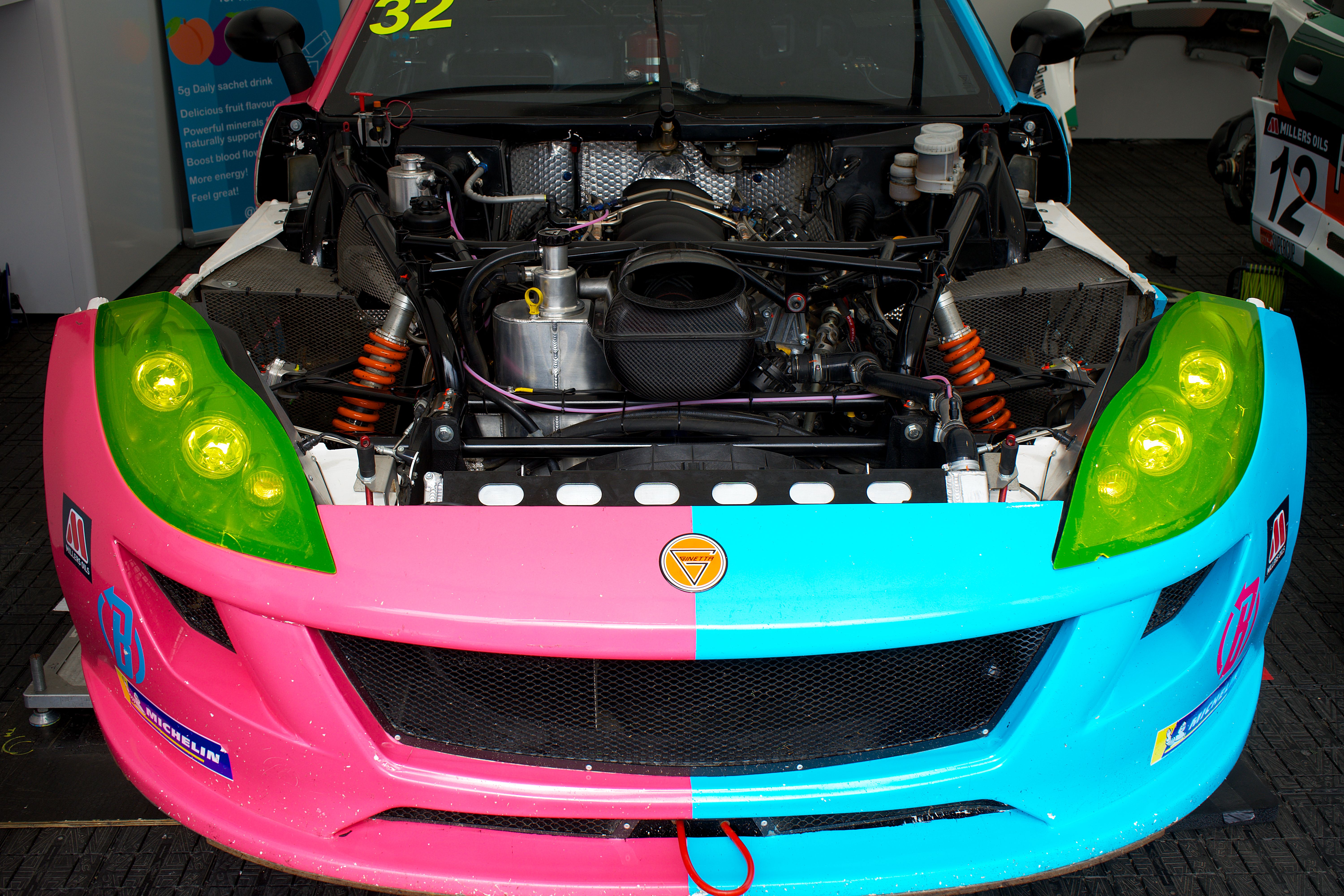 Race Car in a Garage · Free Stock Photo