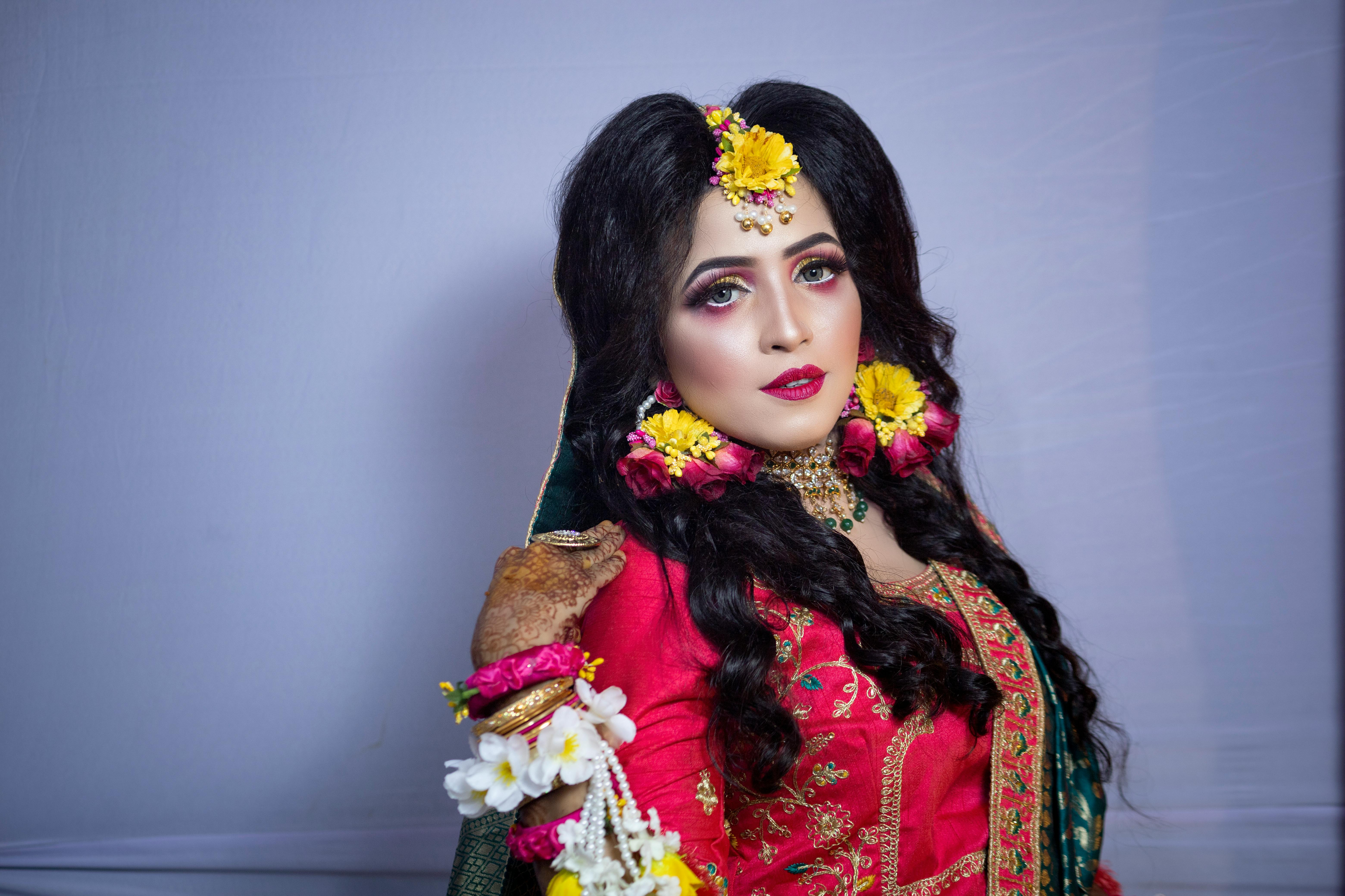 A Beautiful Woman with Curly Hair Wearing Red Lehenga · Free Stock Photo