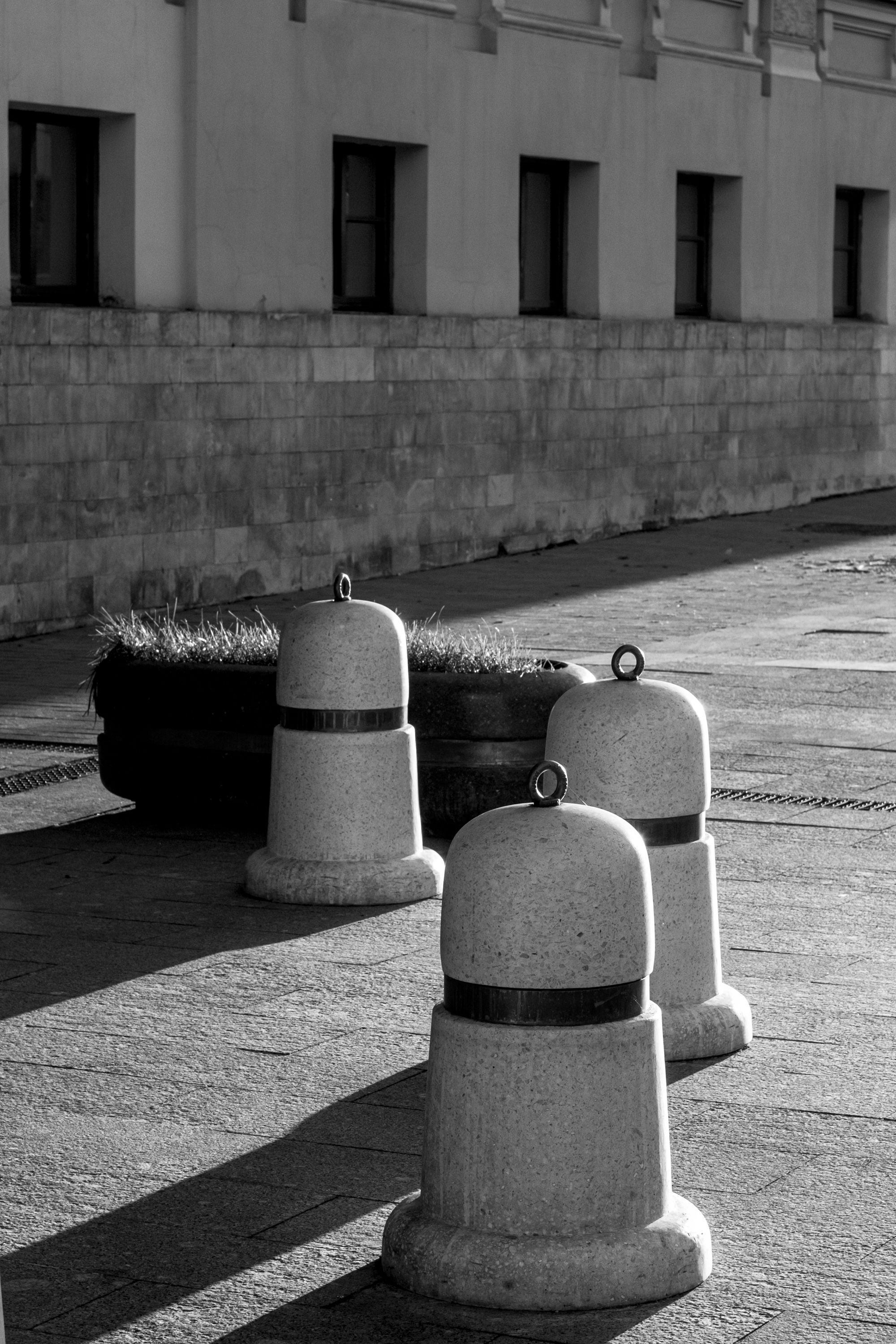 Grayscale Photography of a Street in Between Buildings · Free Stock Photo