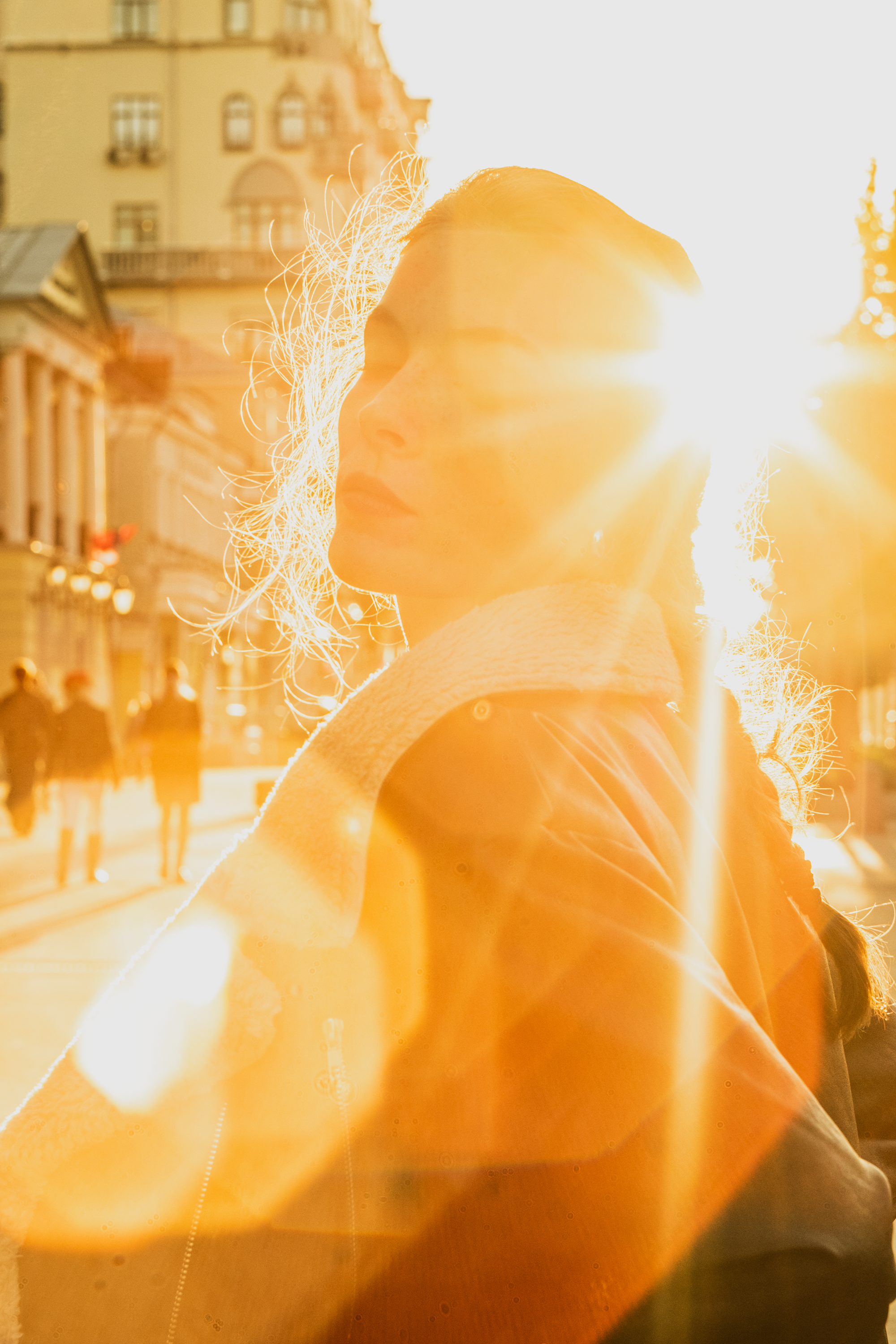 Young Woman in City in Backlit · Free Stock Photo