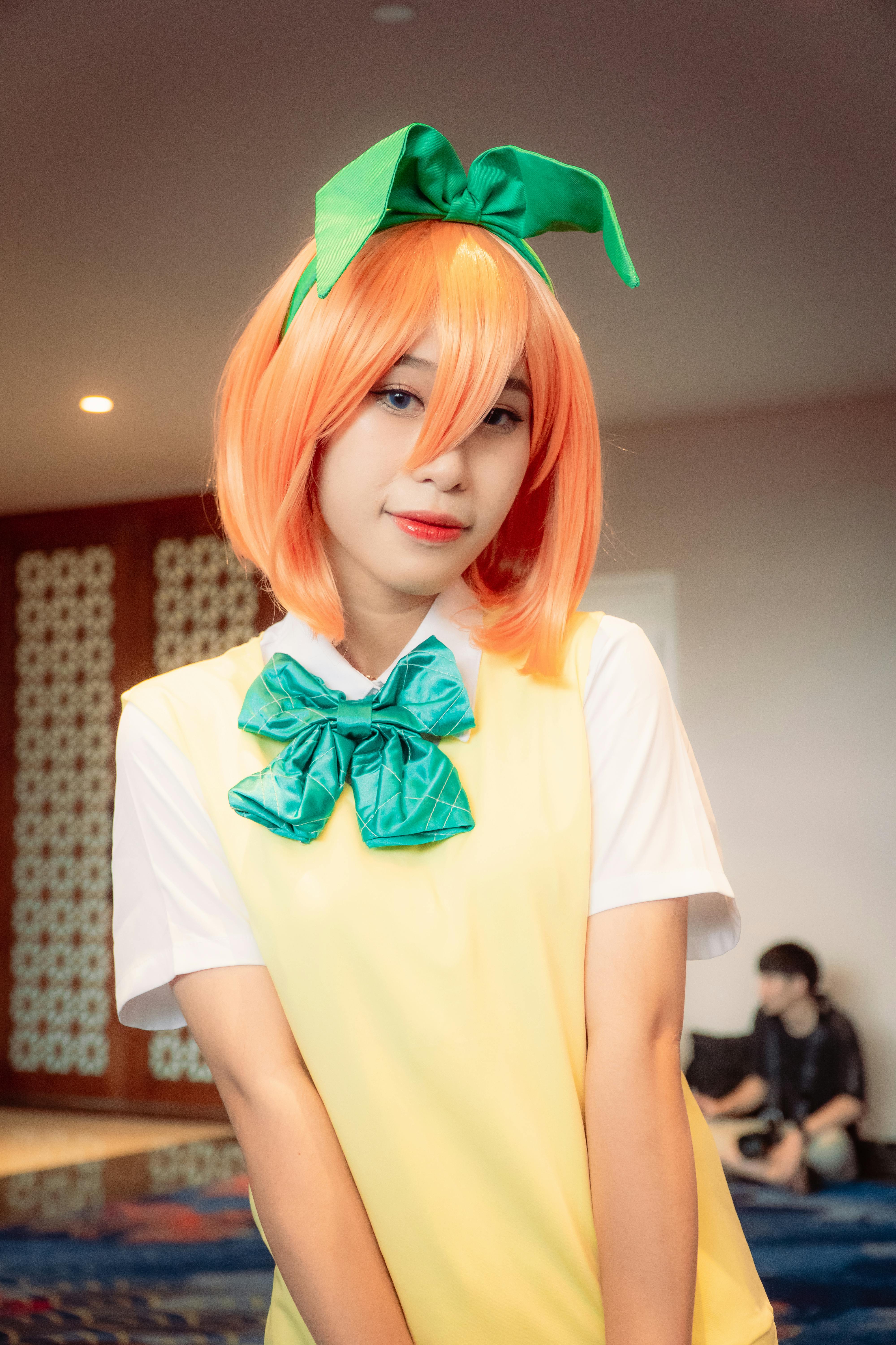 Green-Haired Female Cosplayer Doing a Peace Sign · Free Stock Photo