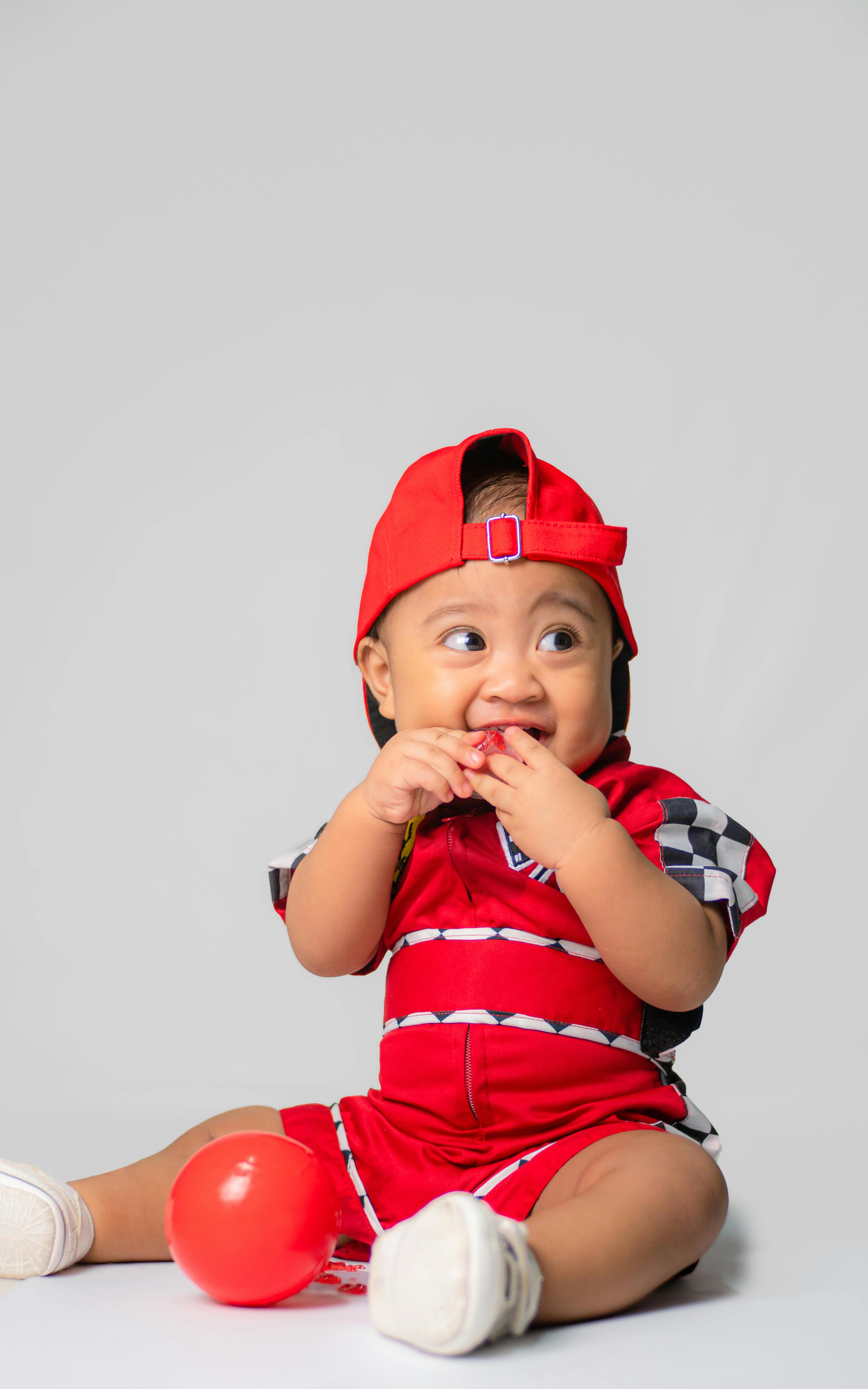 A Boy in Red Shirt and Red Cap · Free Stock Photo