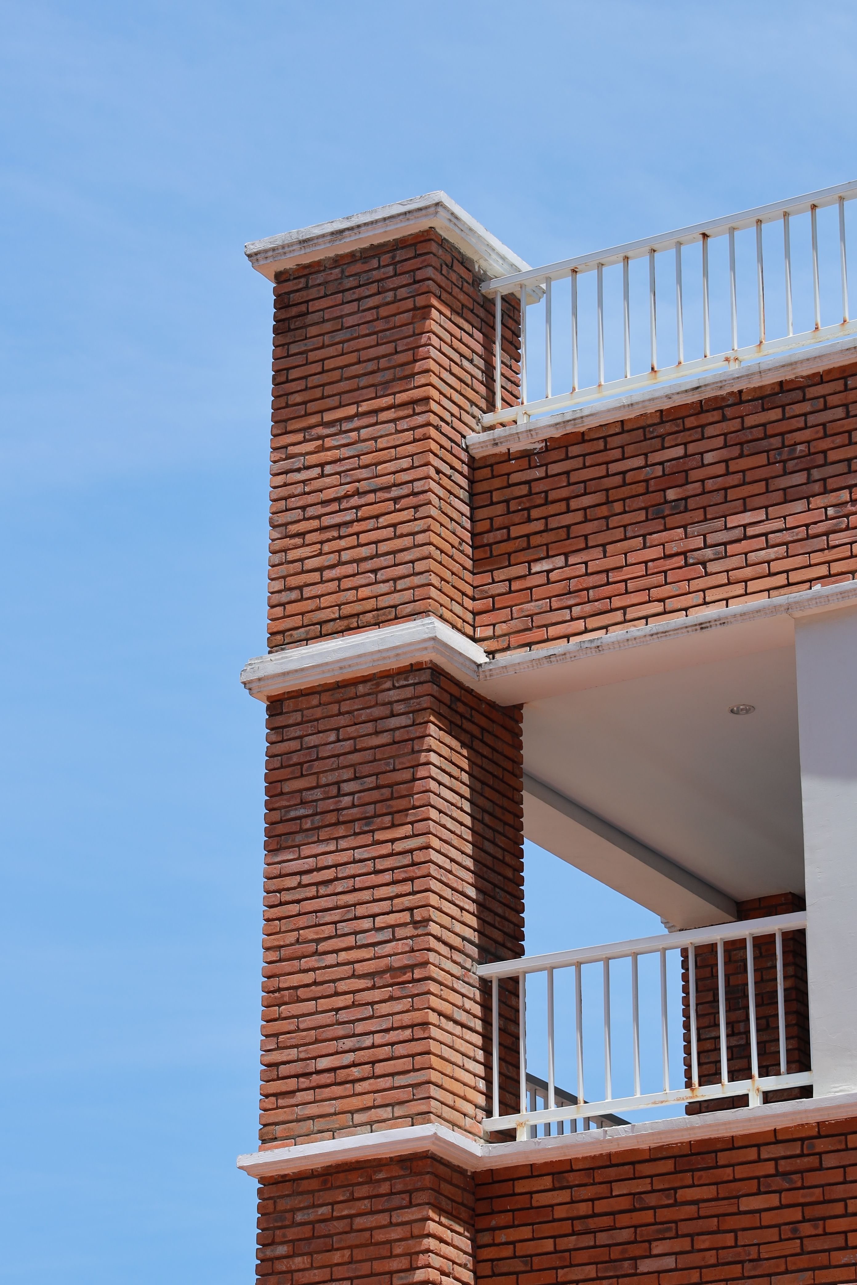 Brown Brick Building Under Blue Sky · Free Stock Photo