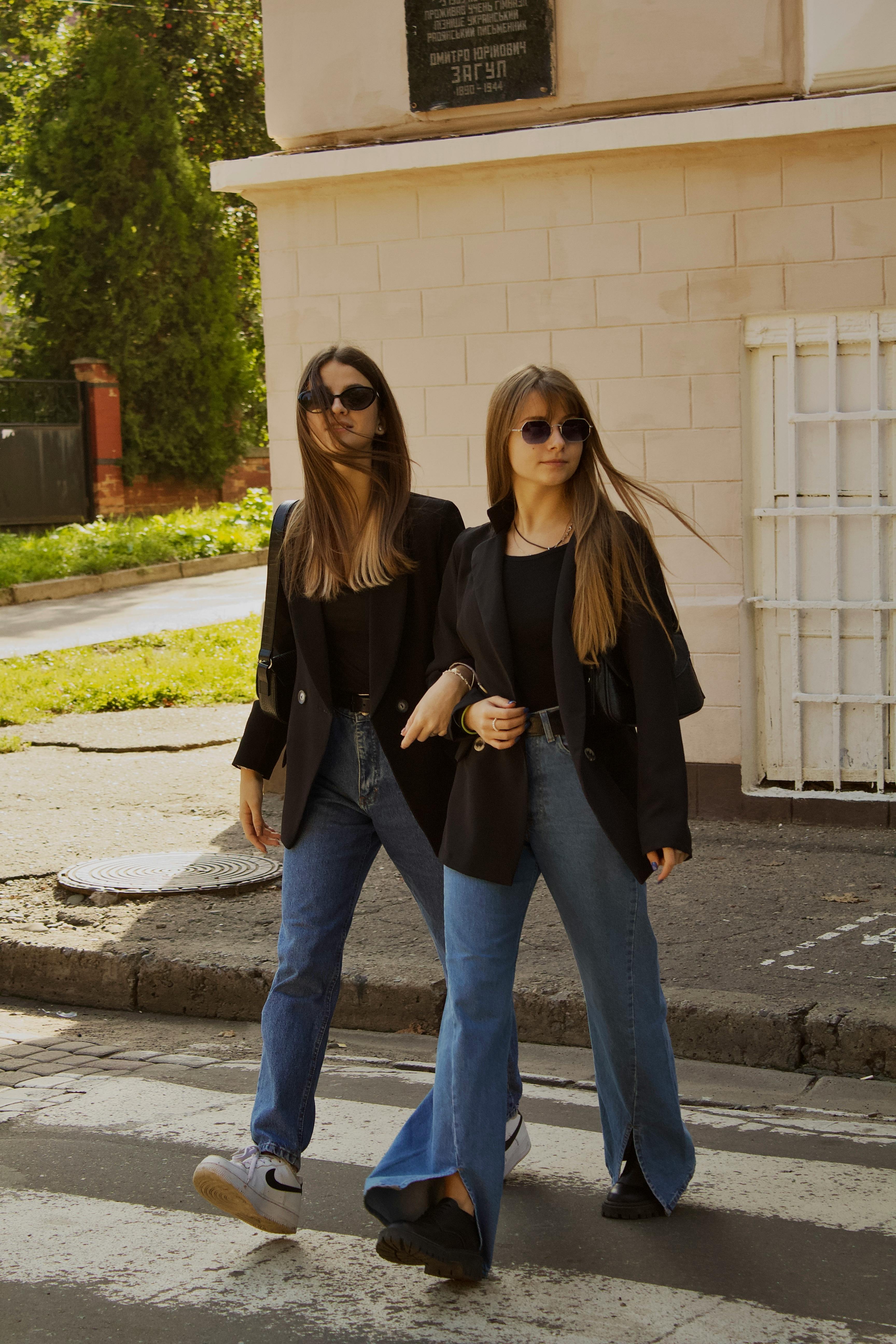 Women Linking Arms Crossing Street · Free Stock Photo