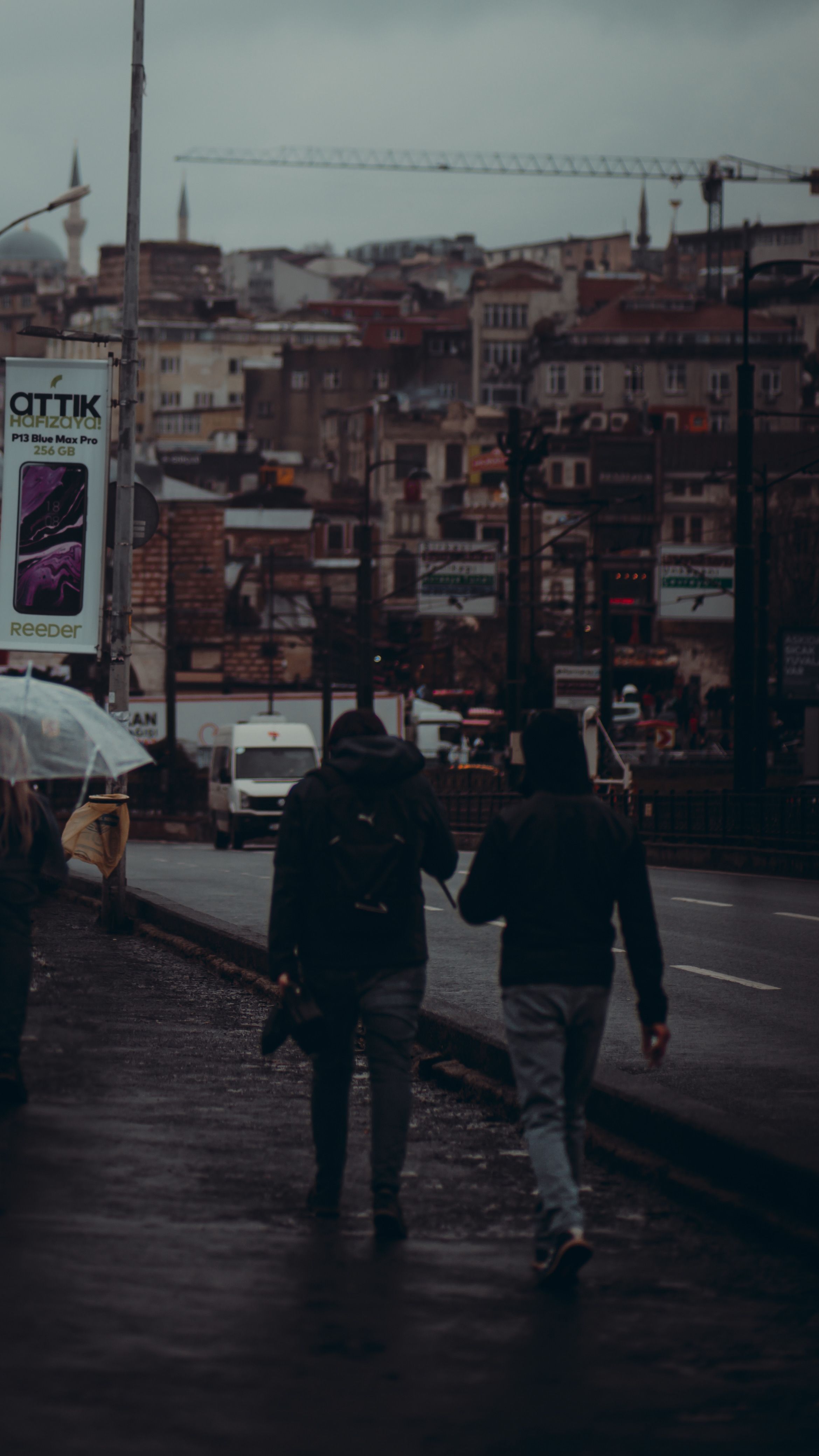 Three People Walking On Concrete Road Free Stock Photo