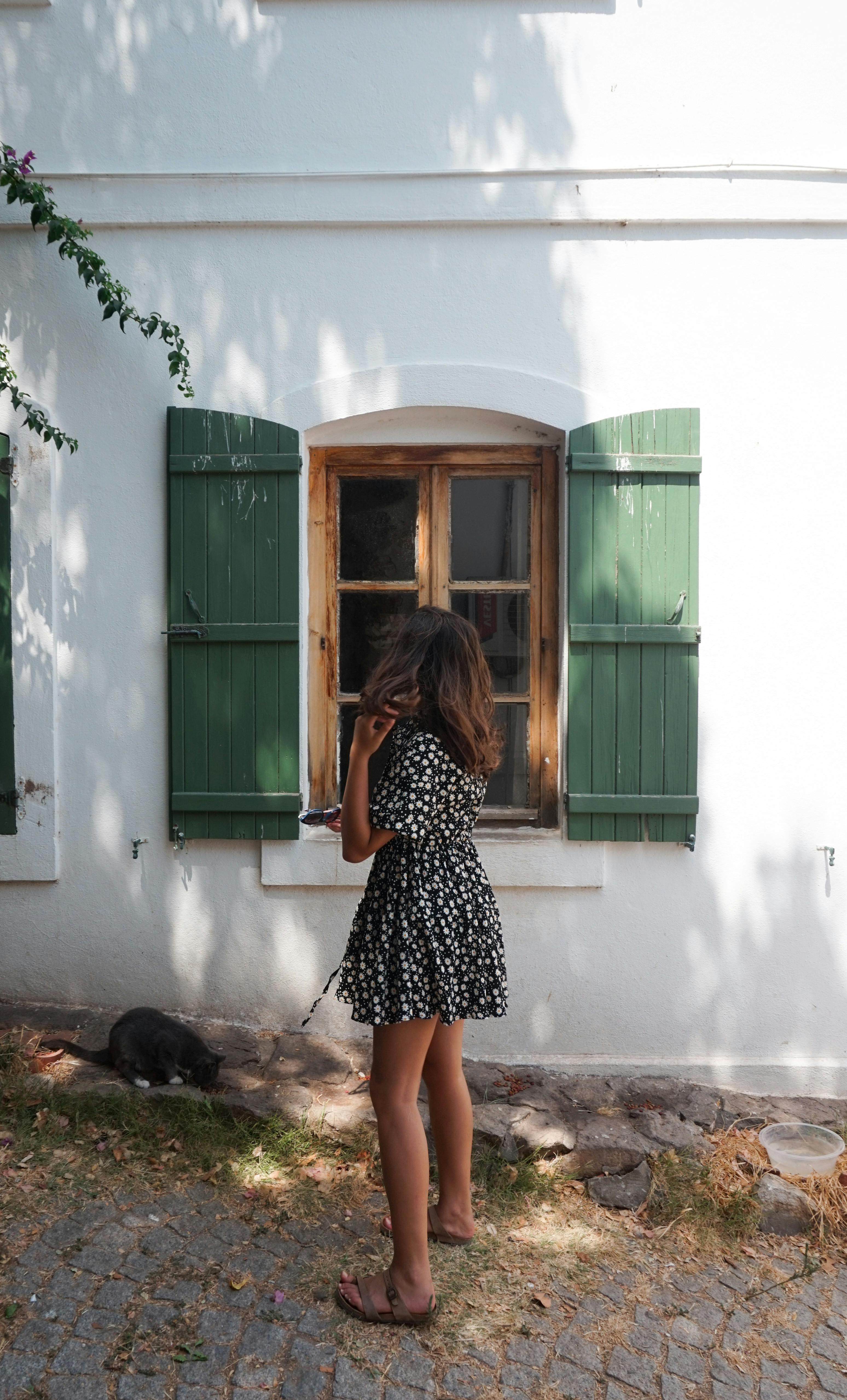 Woman Standing near Window · Free Stock Photo