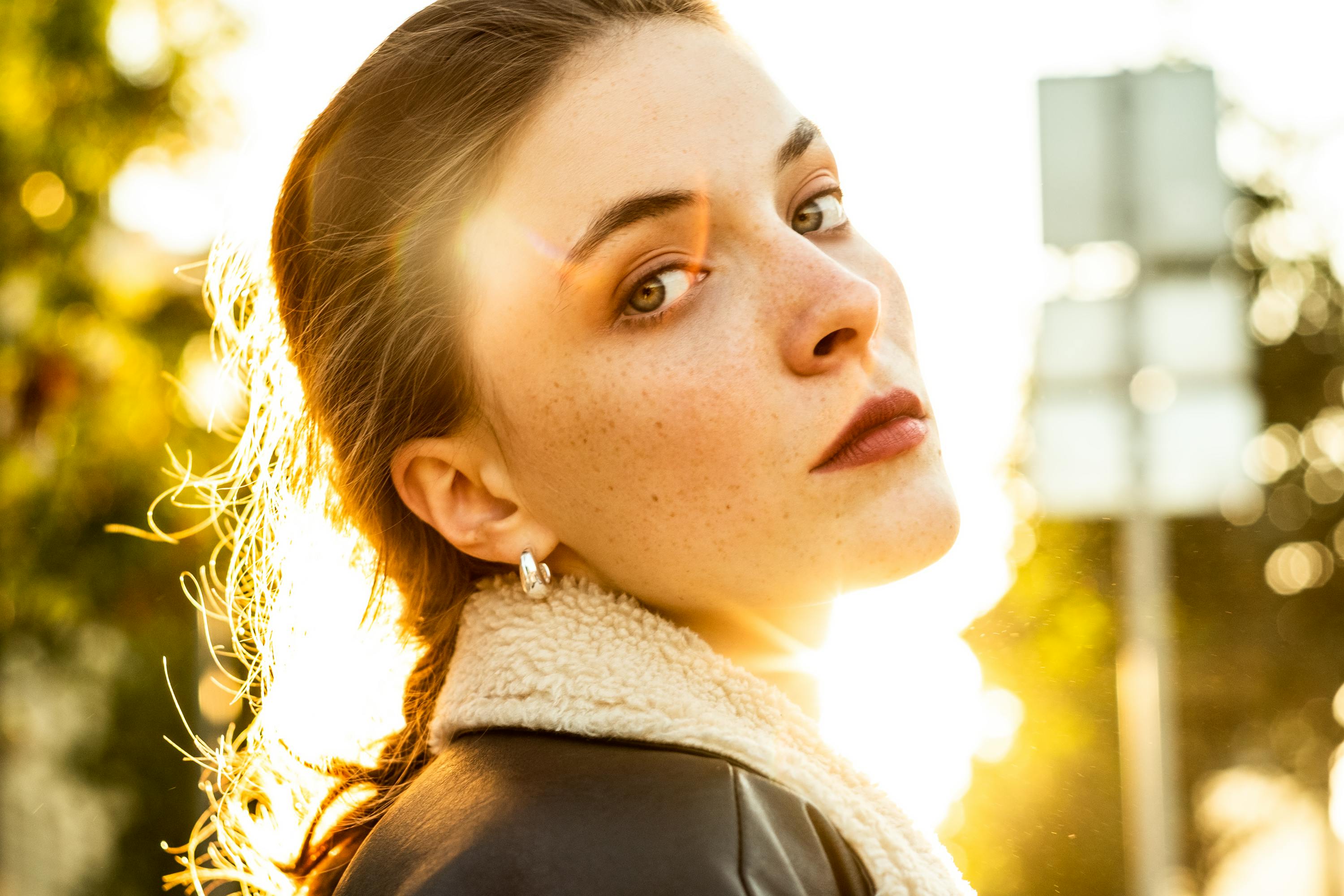 Beautiful Young Woman Looking Over Her Shoulder · Free Stock Photo
