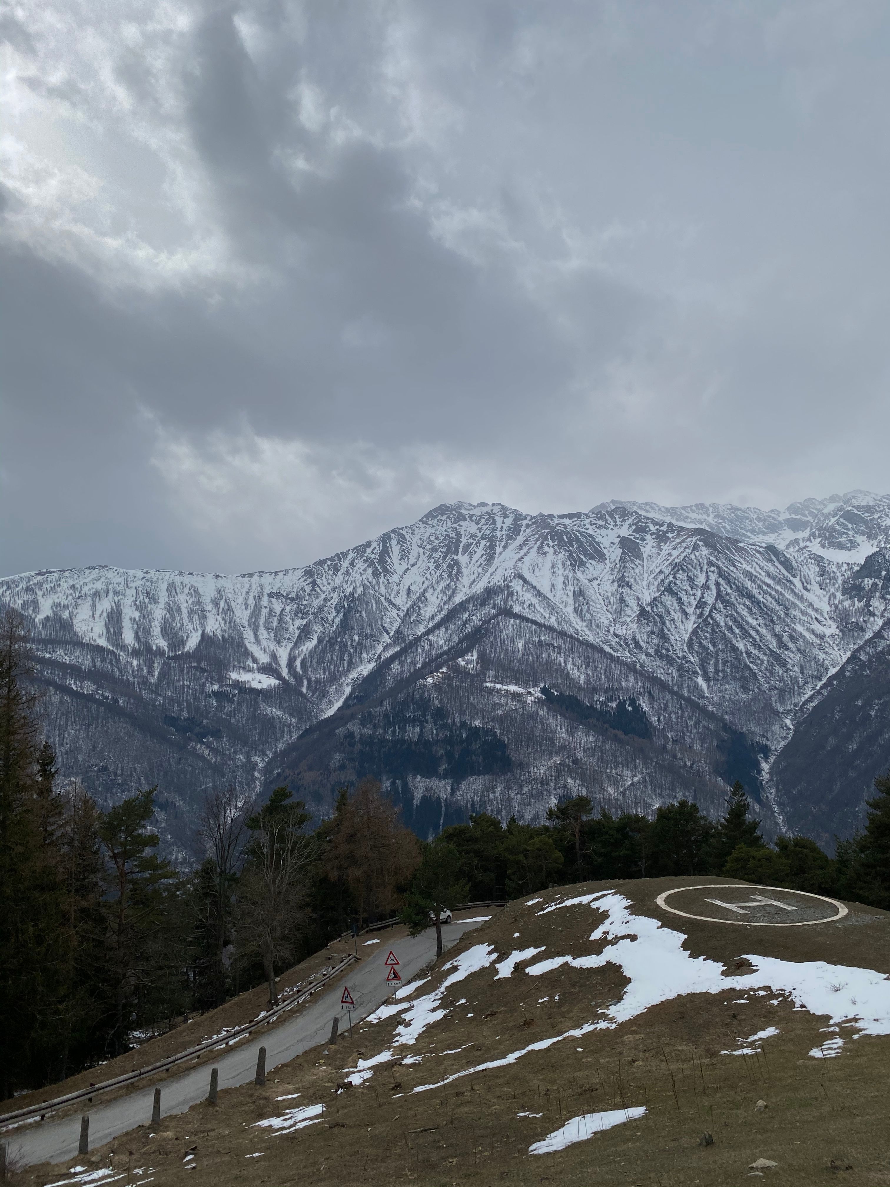 Snow Covered Mountain under a Cloudy Sky · Free Stock Photo
