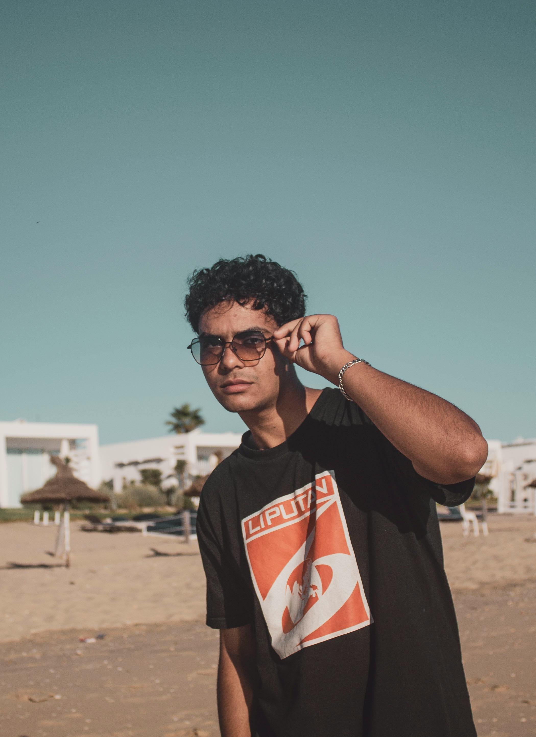 A Man Behind a Woman Riding a Pushcart · Free Stock Photo