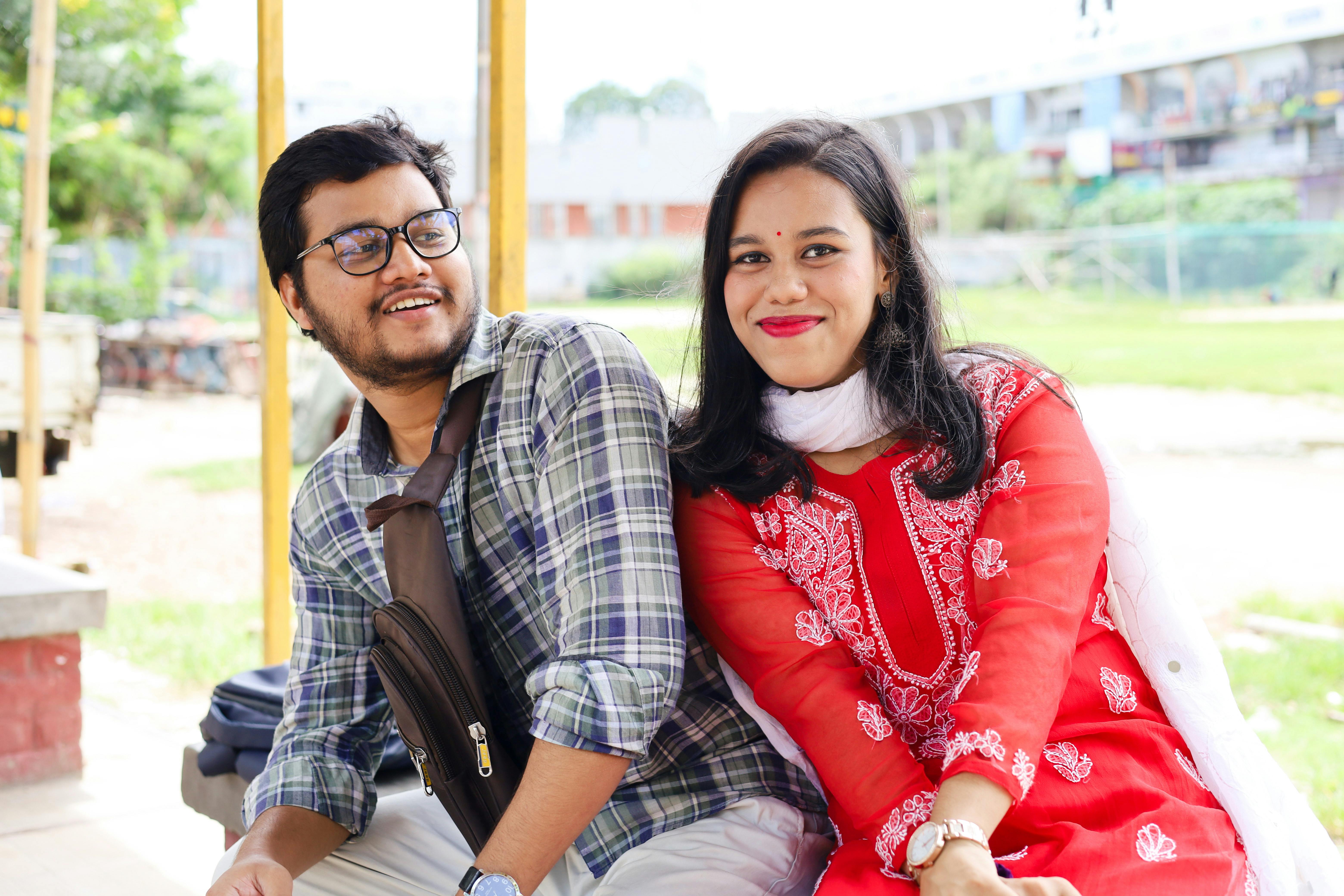 A Man and Woman Sitting Together · Free Stock Photo