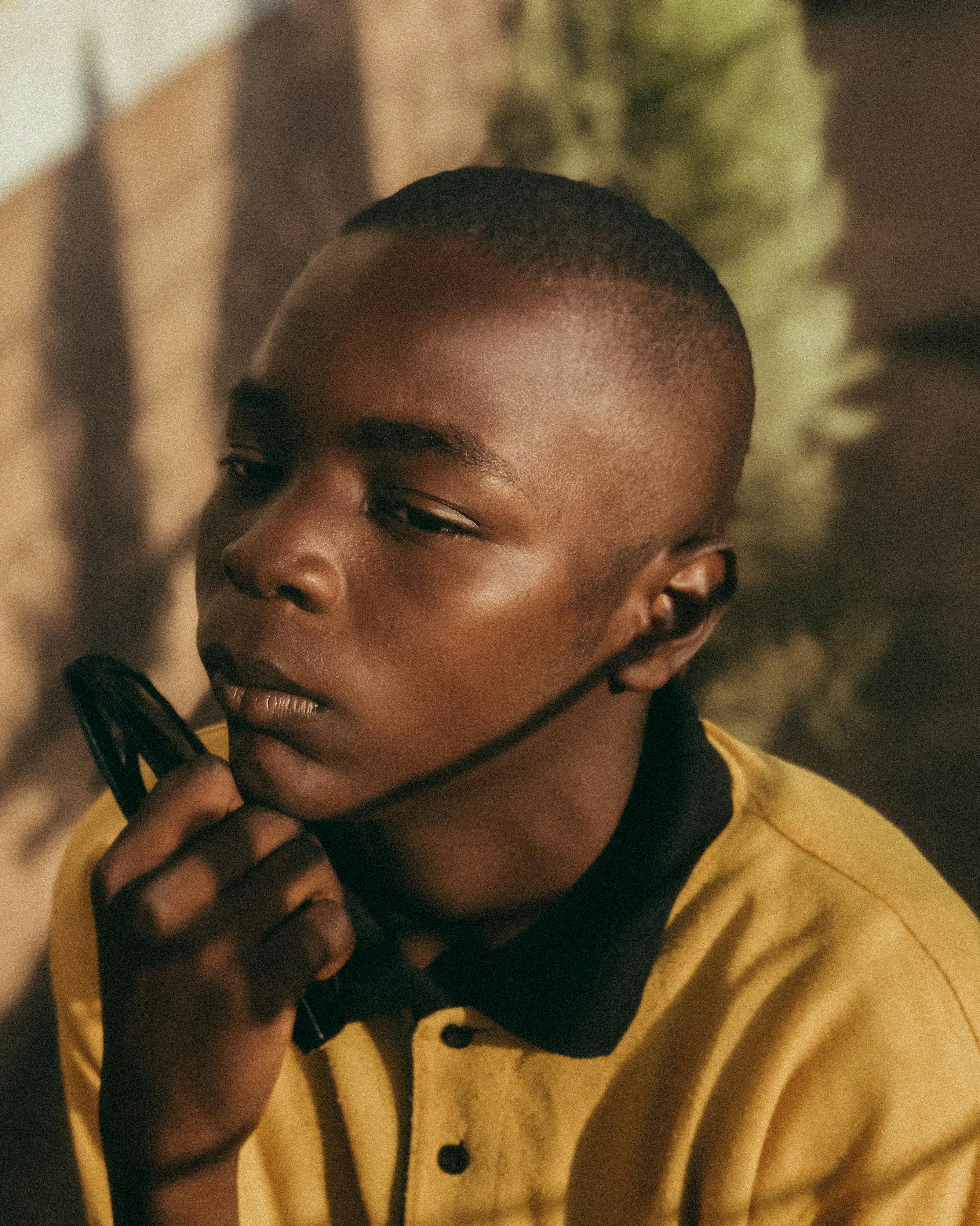Portrait of a Boy in a Yellow Shirt · Free Stock Photo