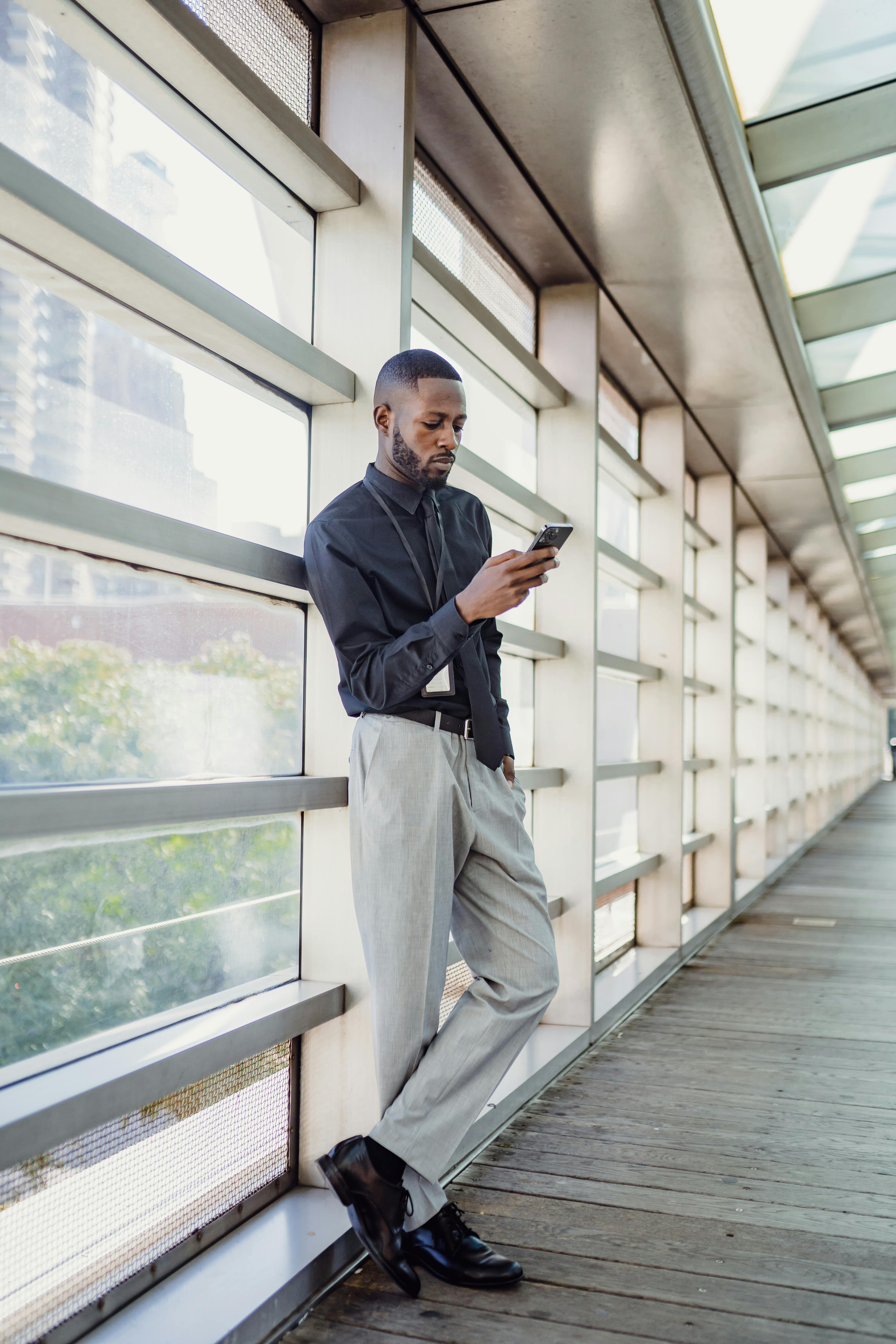 A Man Using his Smart Phone · Free Stock Photo