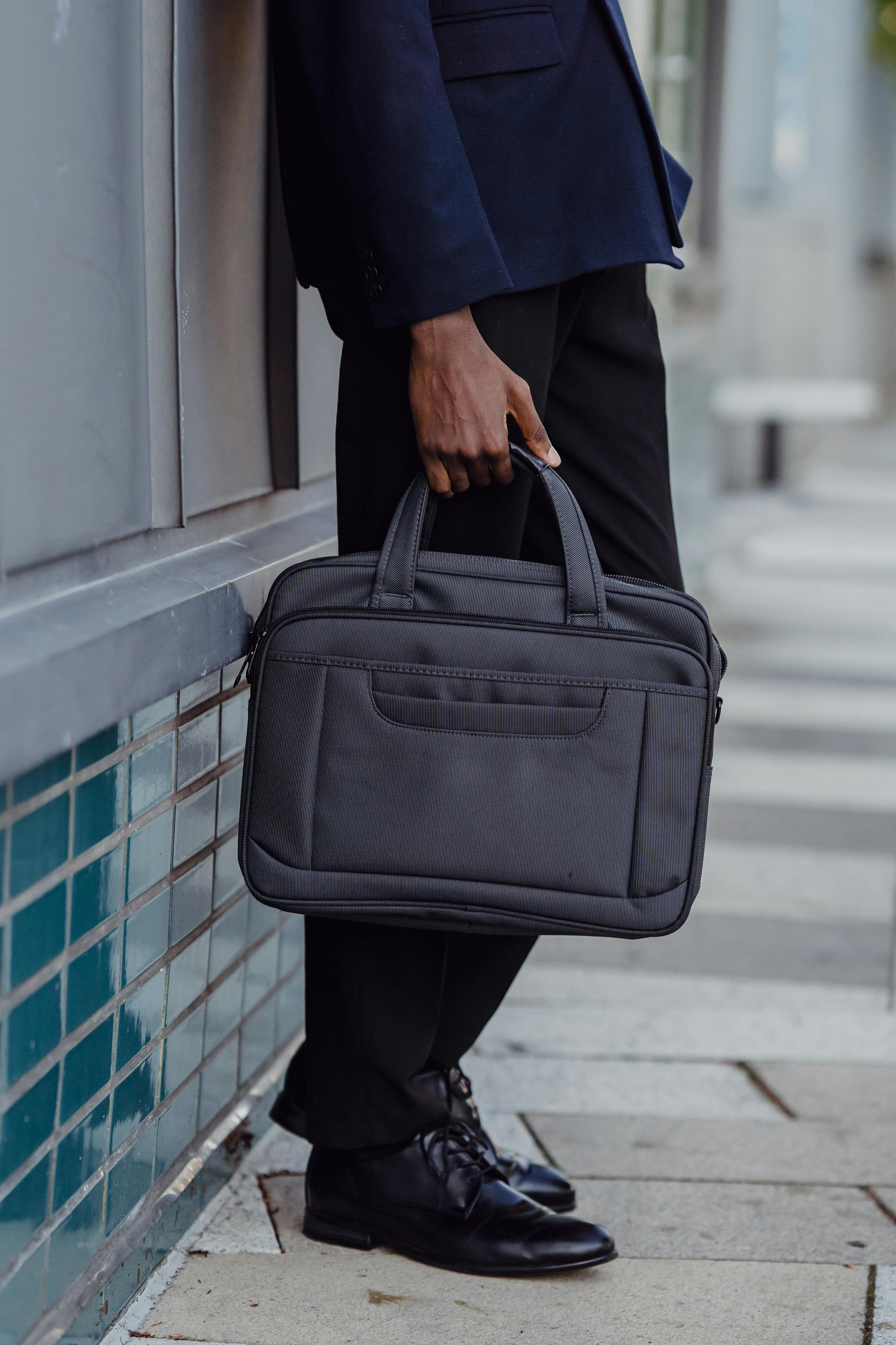 Close-Up Shot of a Person Holding a Brown Paper Bag · Free Stock Photo