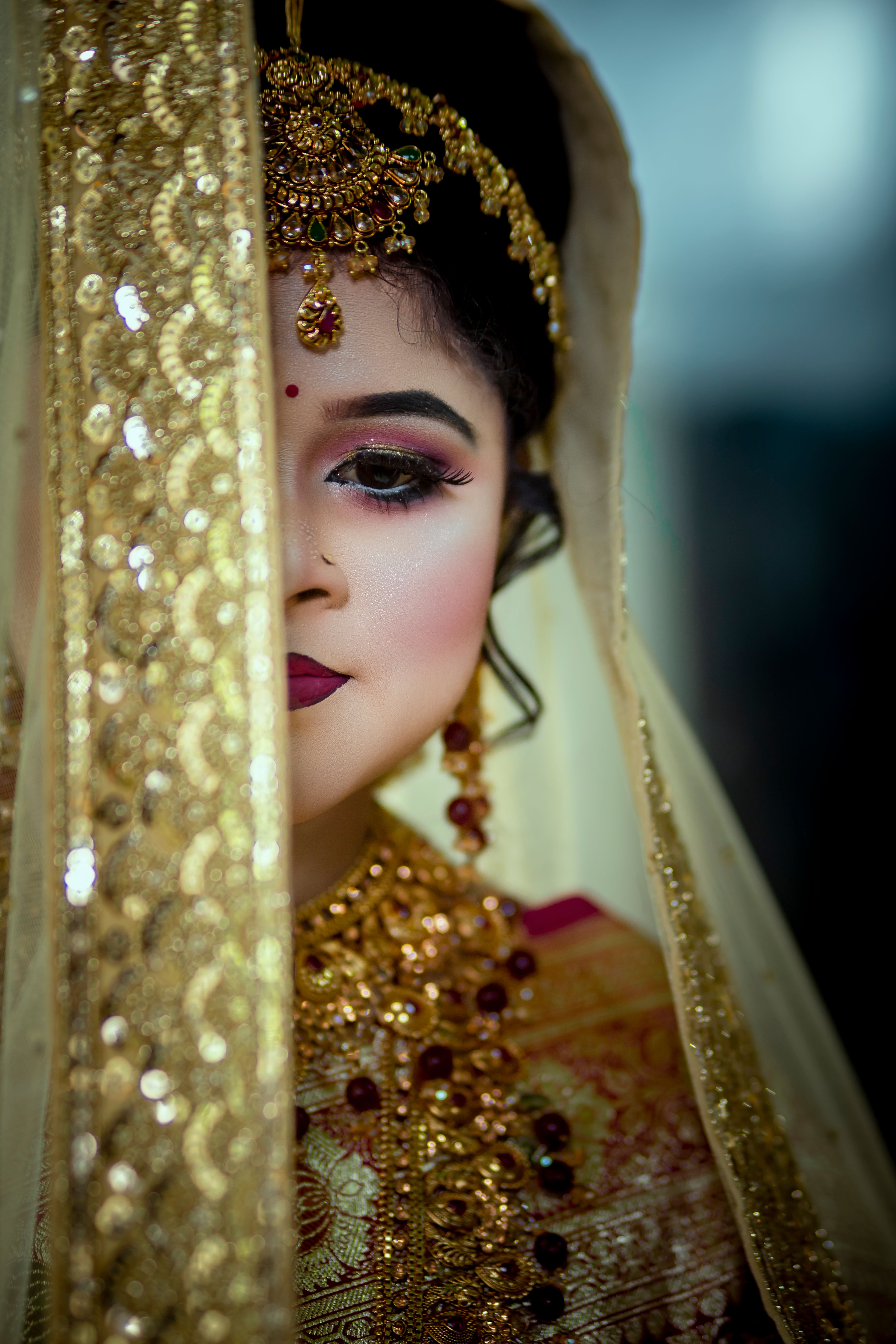 Two Young Women Posing in Ornate Clothing · Free Stock Photo