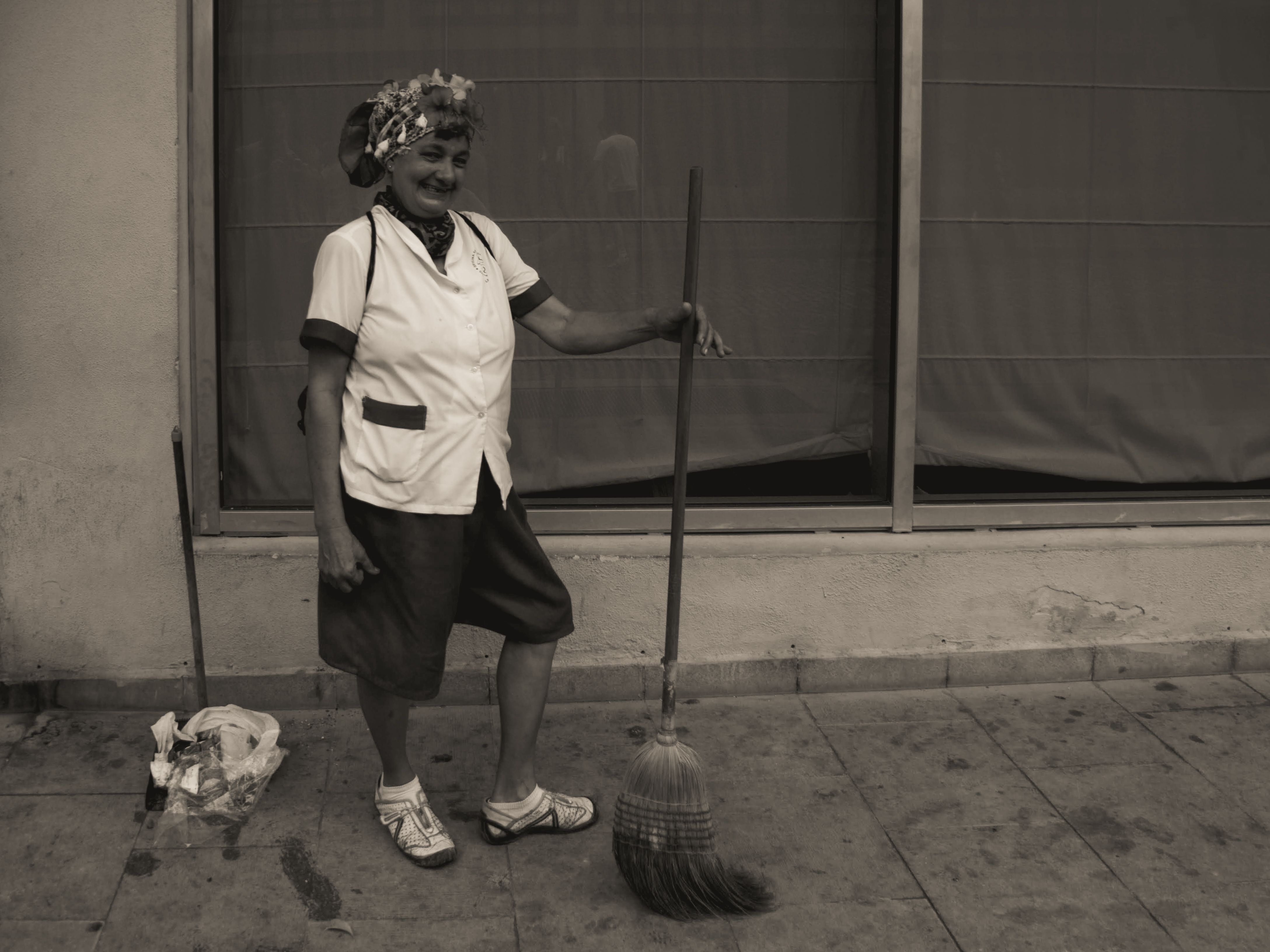 A Man Sweeping the Ground with a Broomstick · Free Stock Photo