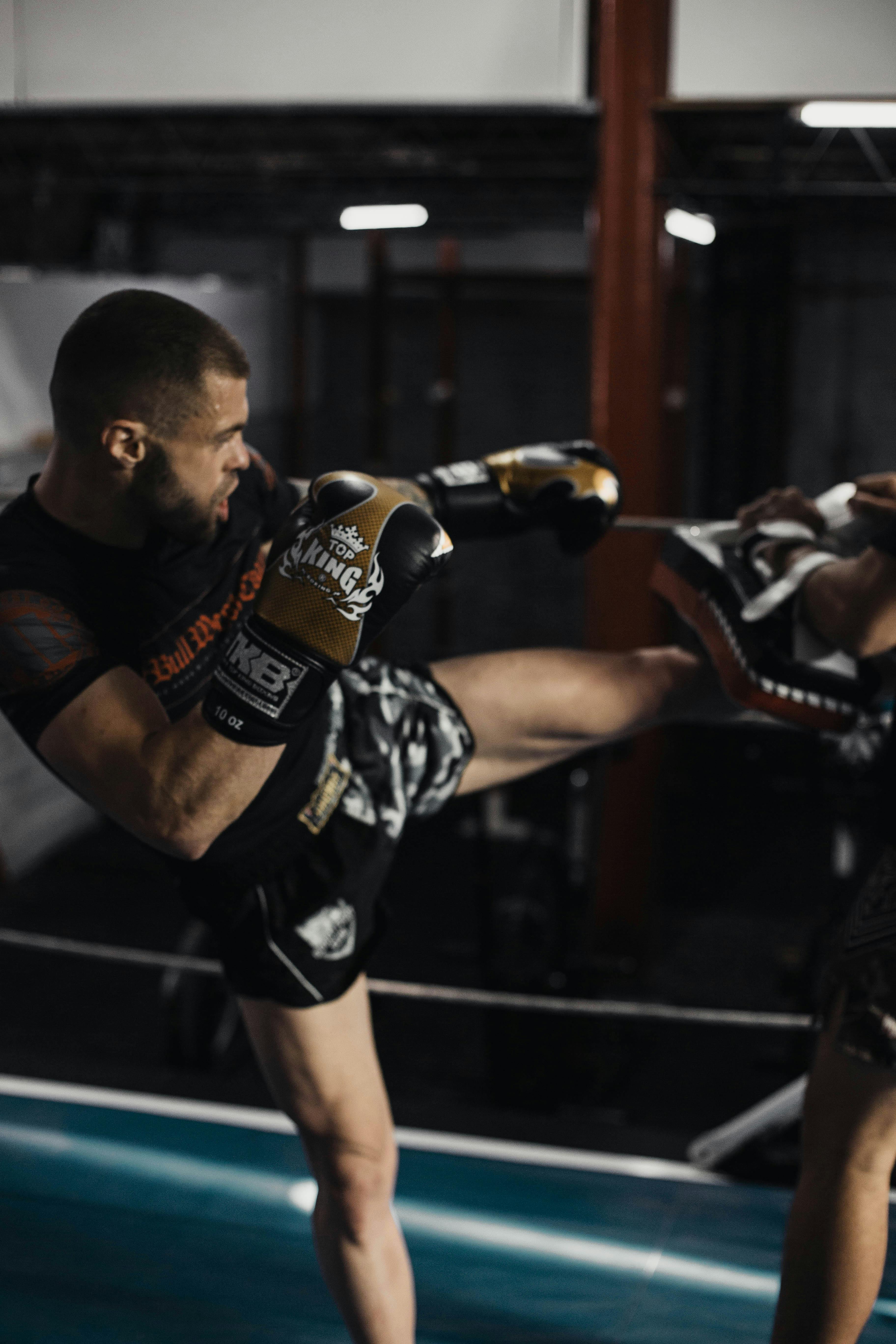 Man Breaking Wooden Plank with Kick · Free Stock Photo