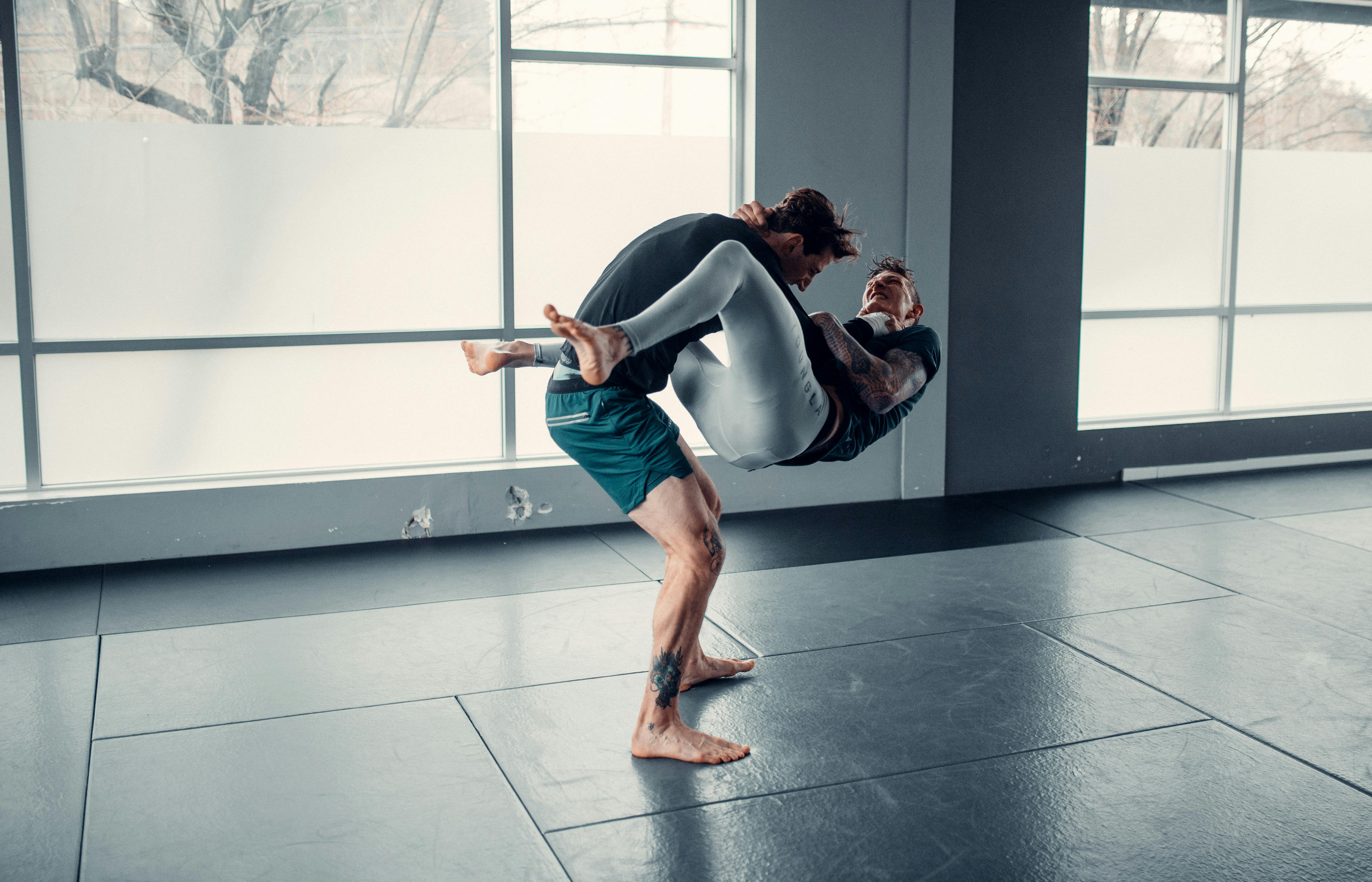 Two Men Sparring in a Gym · Free Stock Photo