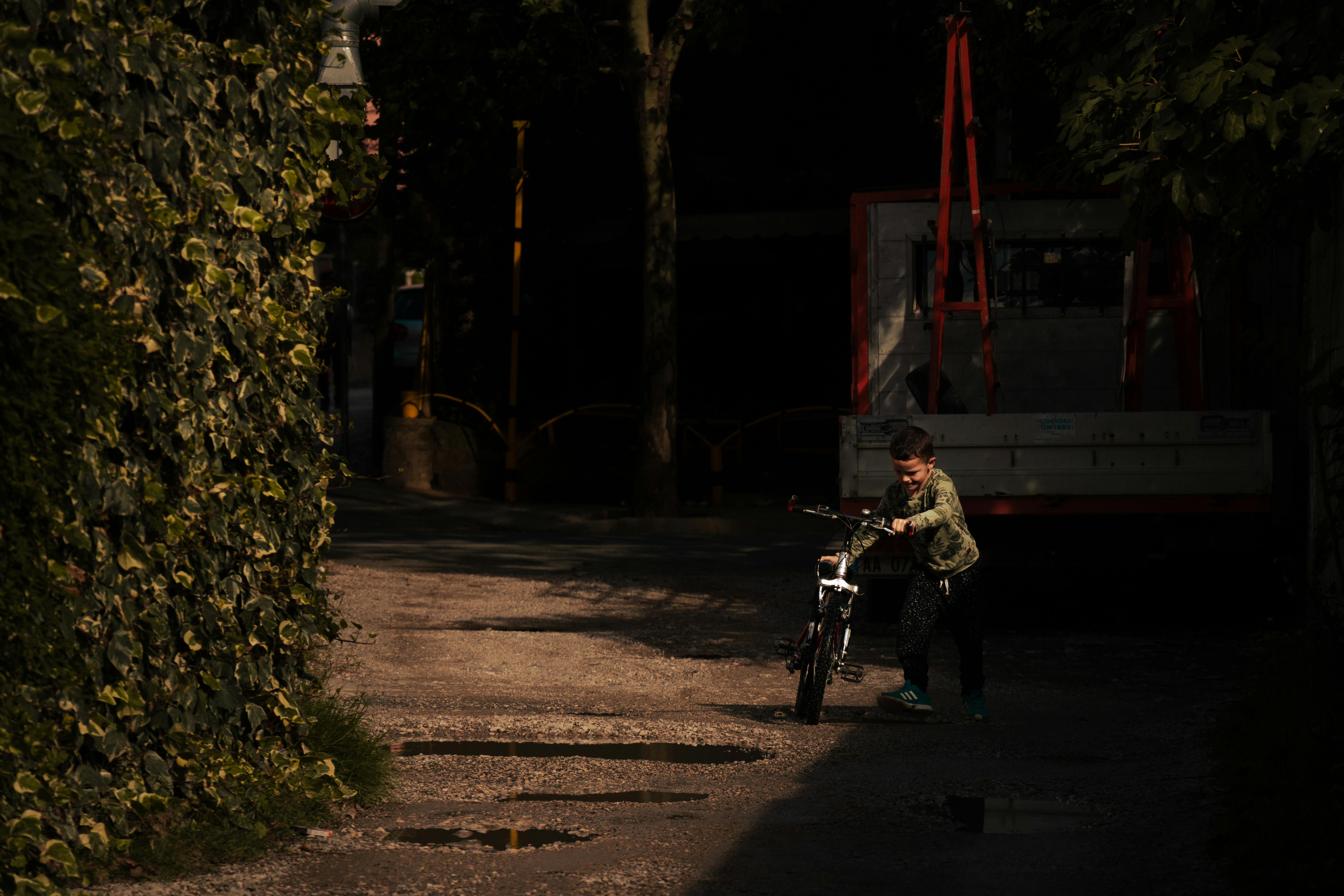 Photo of Boy Riding a Bike · Free Stock Photo
