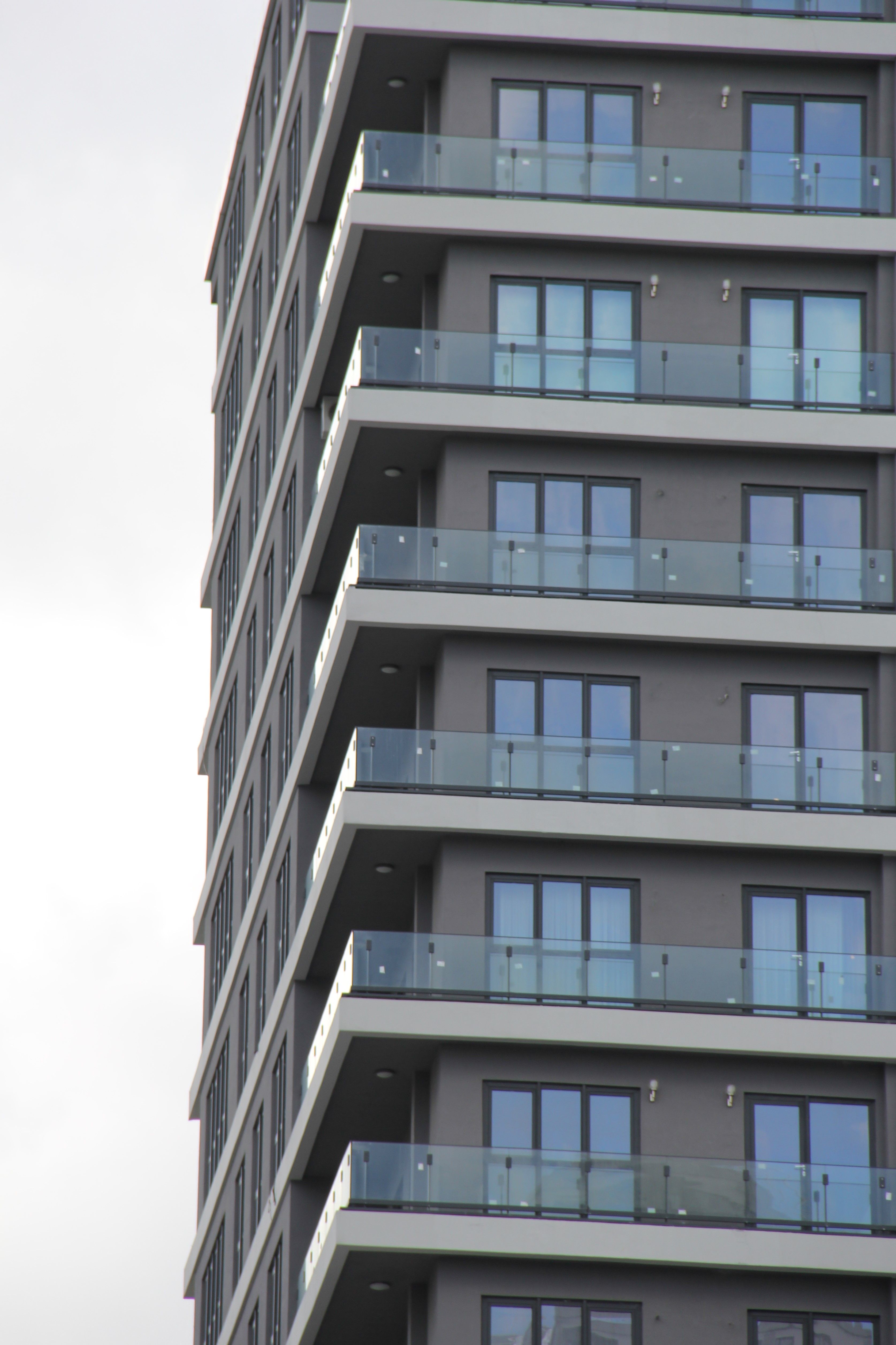 A Building with Glass Railings · Free Stock Photo