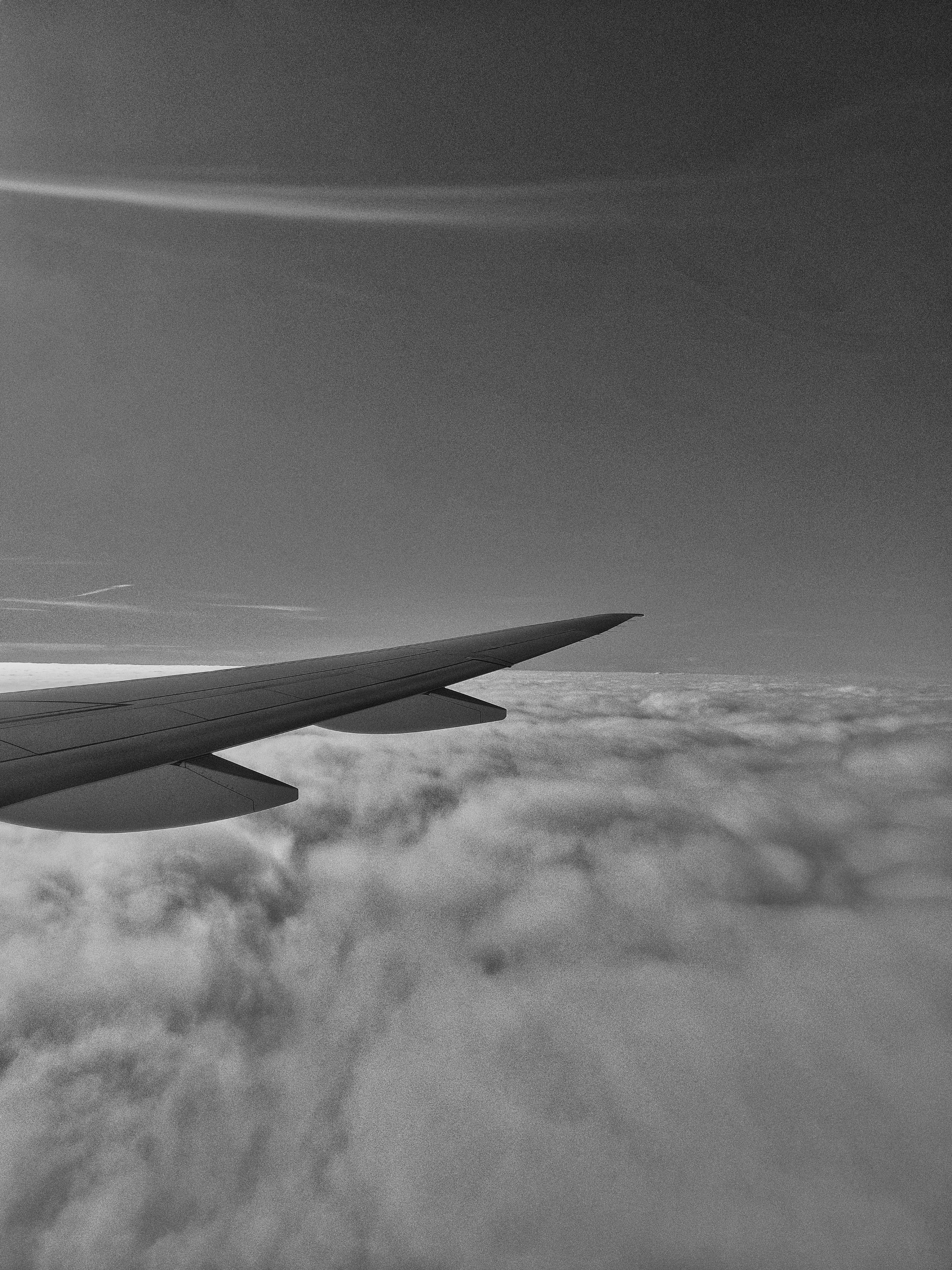 Grayscale Photo of an Airplane Wing · Free Stock Photo