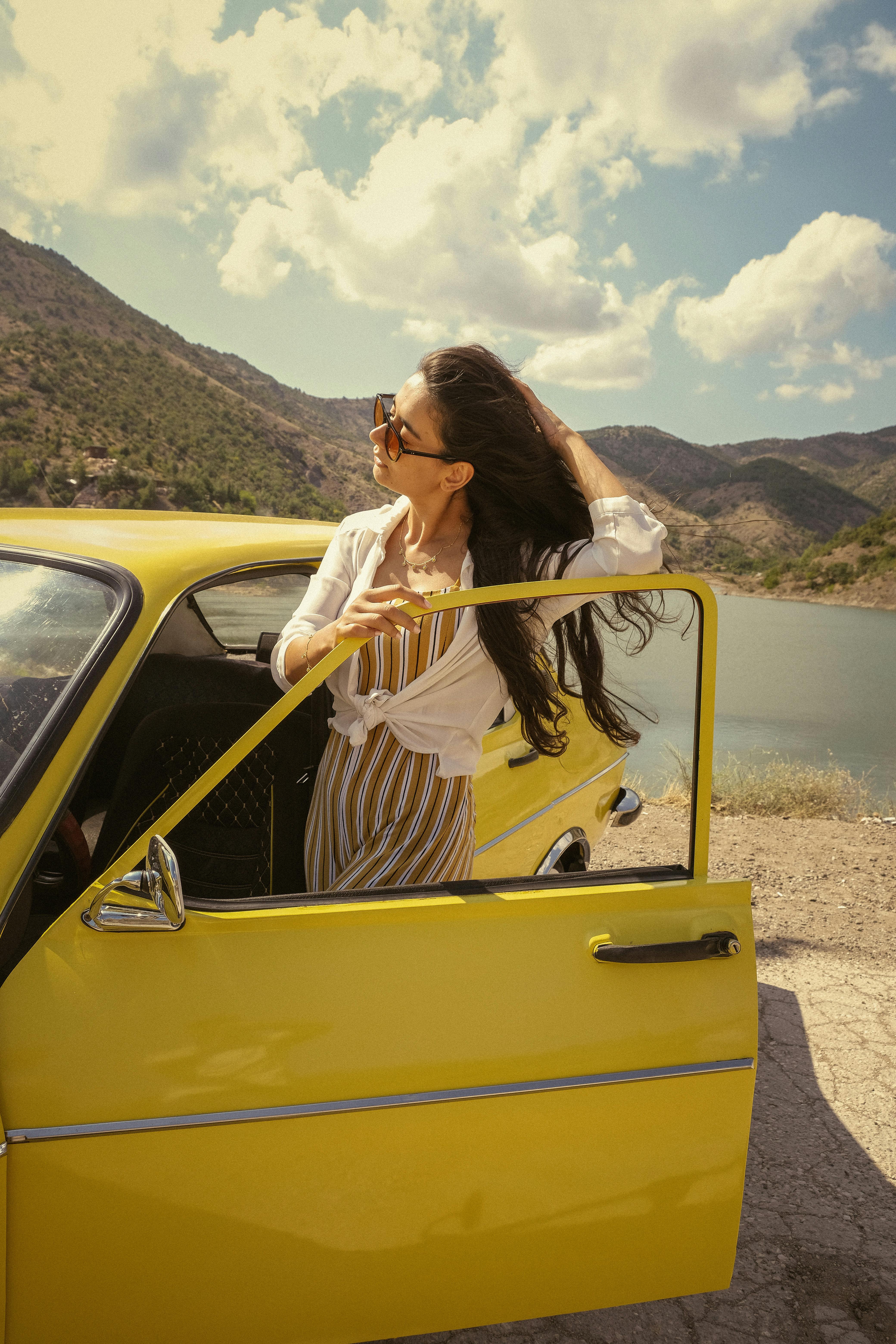 A Woman Getting into a Car · Free Stock Photo