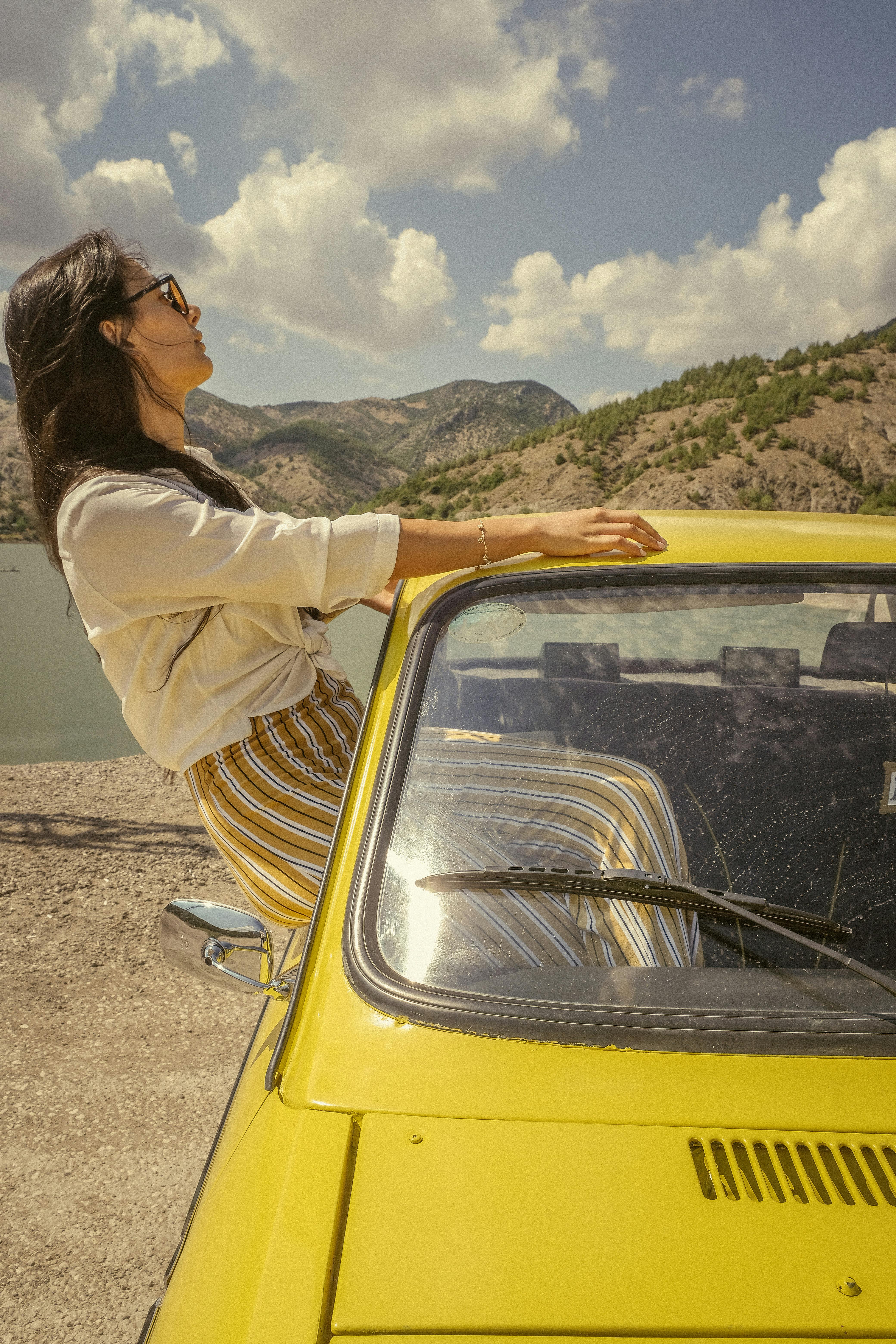 Woman Sitting on Car's Window · Free Stock Photo