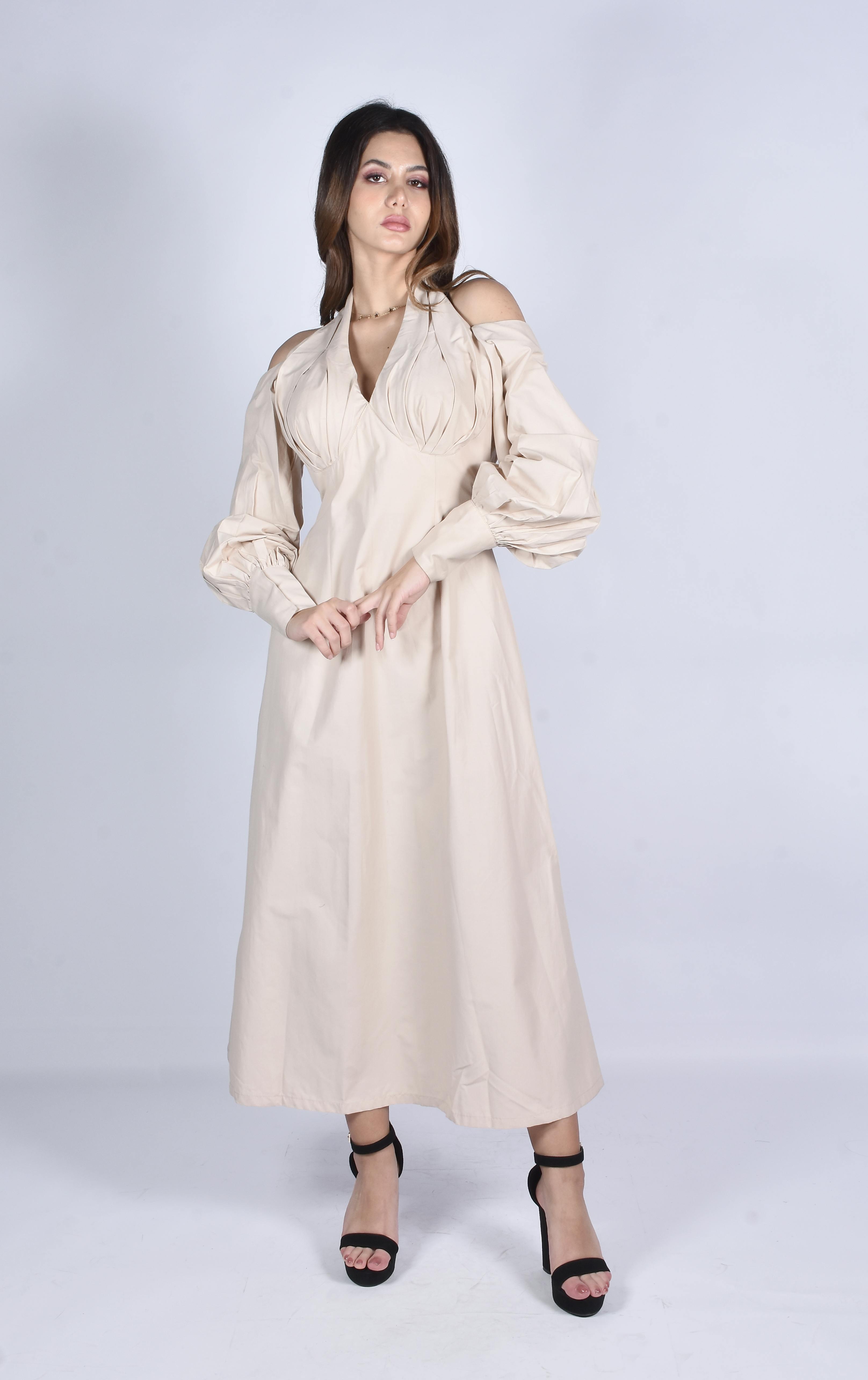 A Woman Wearing a Beige Dress · Free Stock Photo