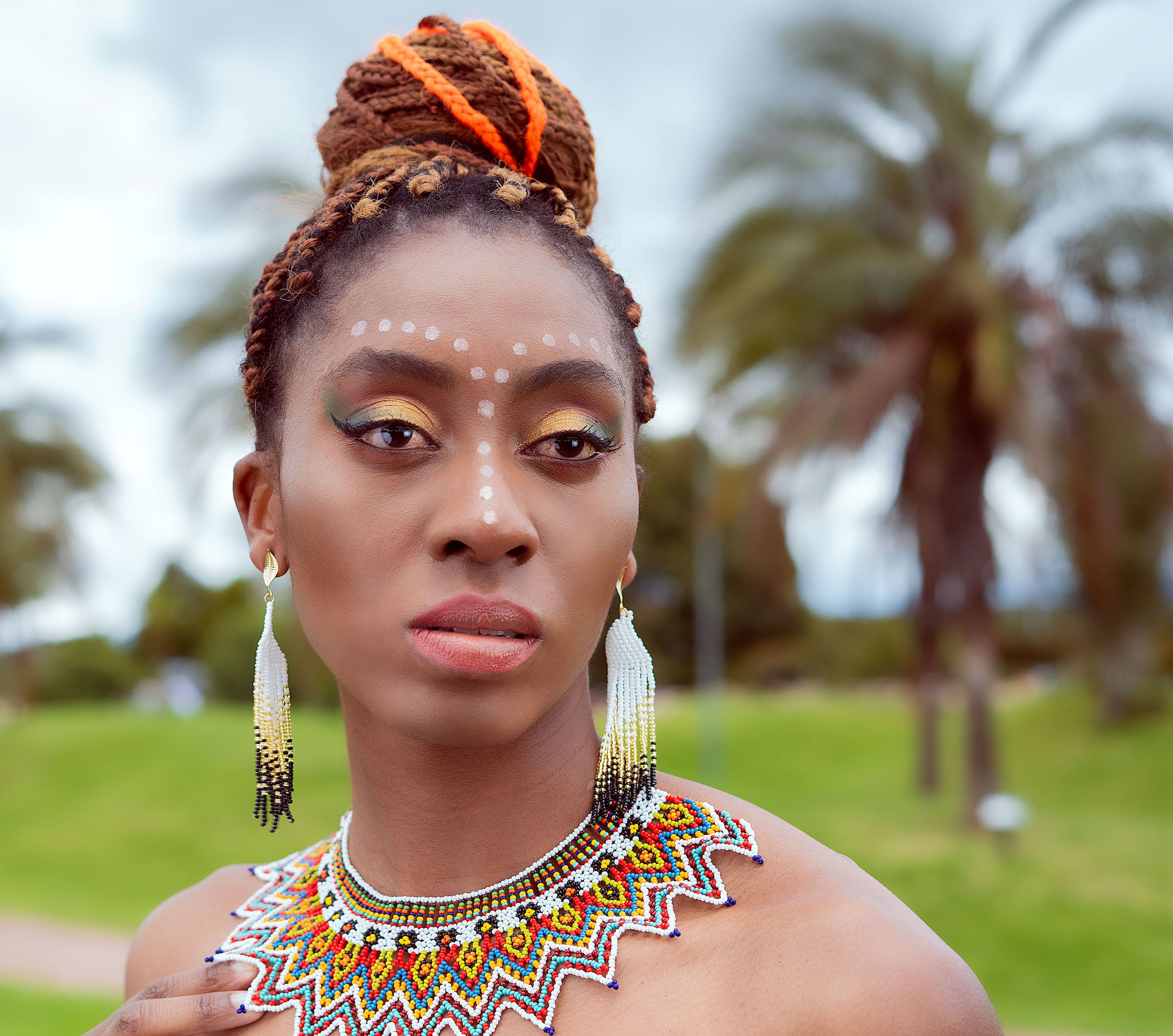A Woman Wearing Beaded Necklace and Earrings · Free Stock Photo