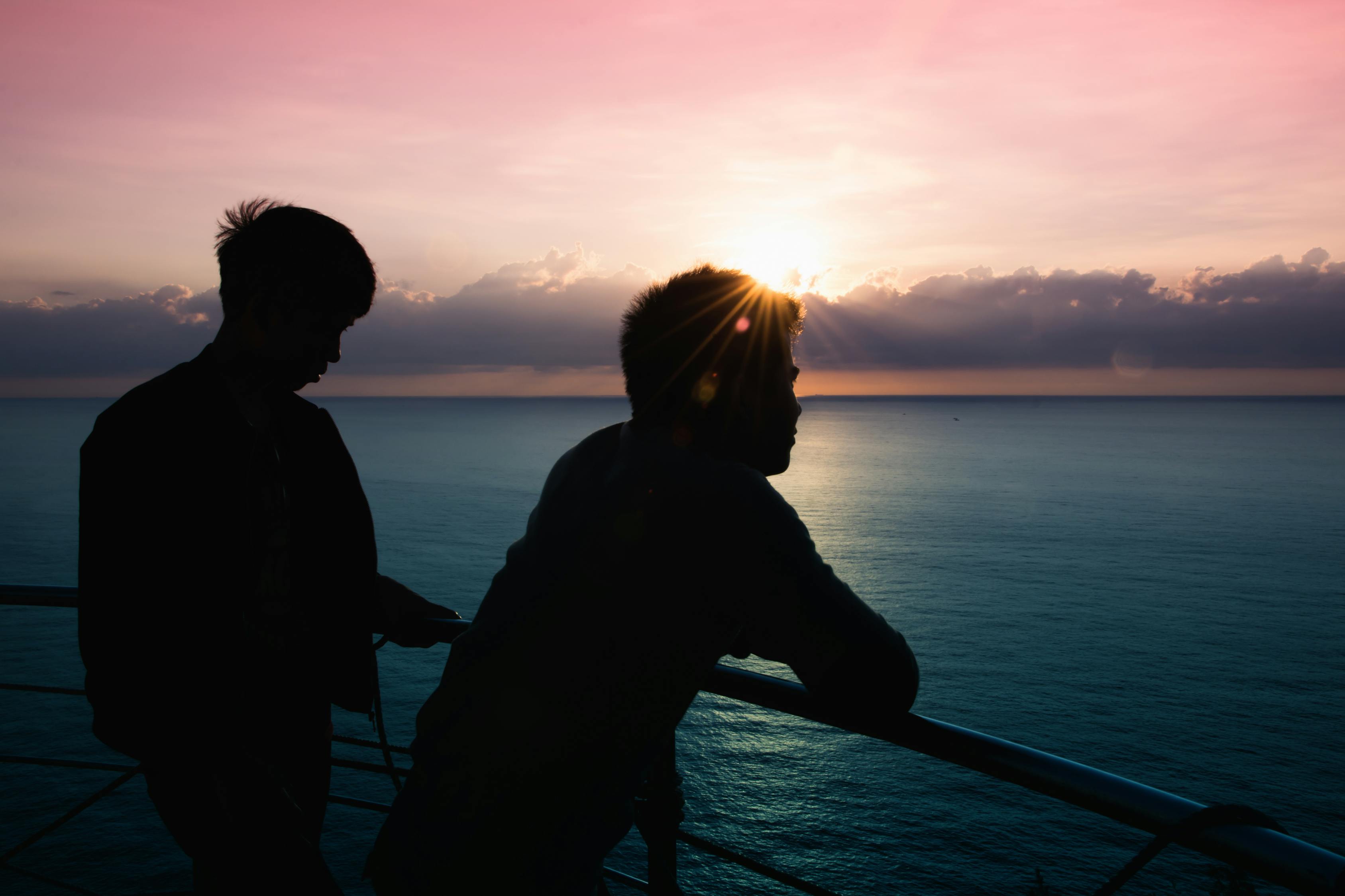 Two Men Standing Near Railings · Free Stock Photo Two Men Standing Near Railings · Free Stock Photo