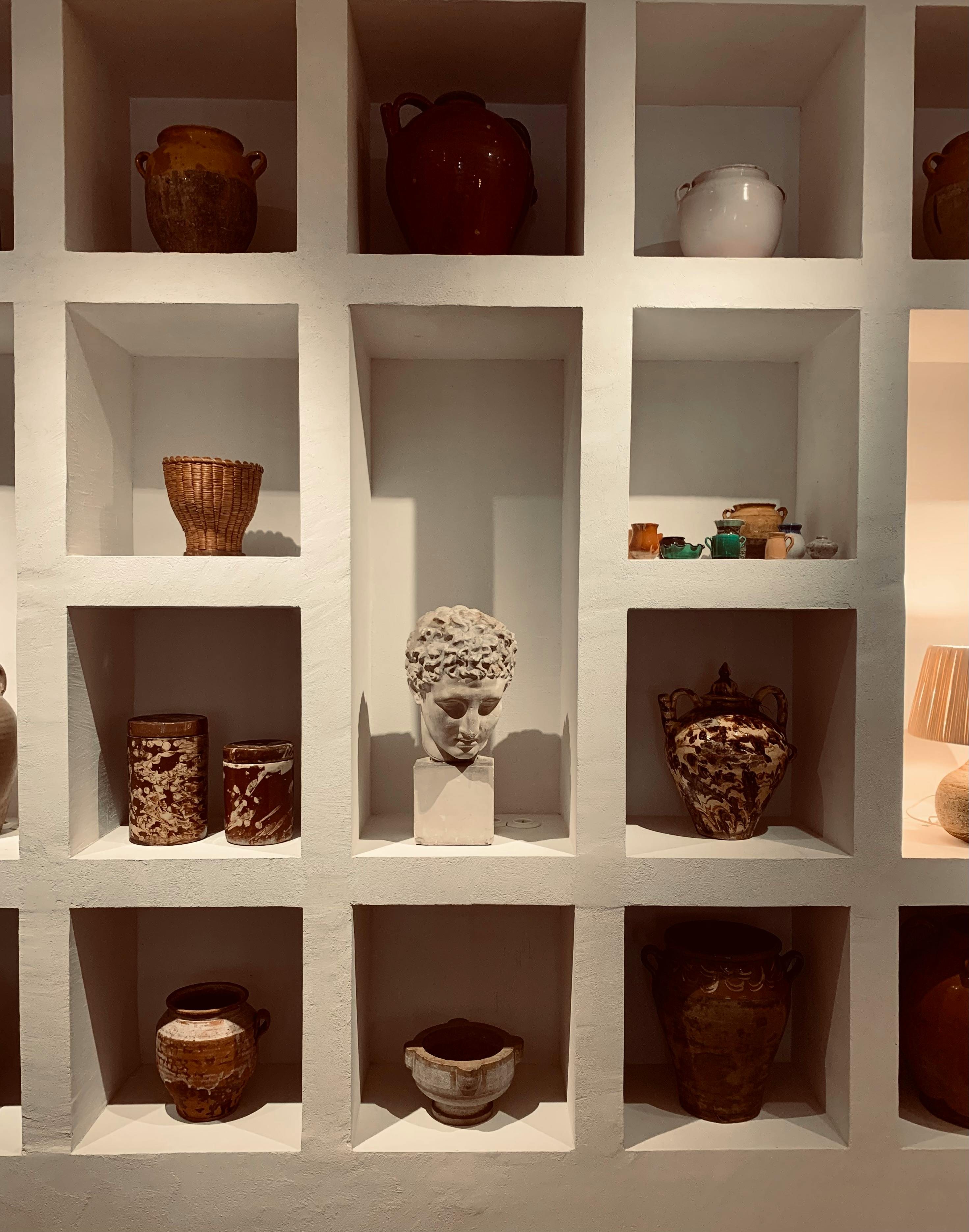 Marble Bust and Vases on Shelves · Free Stock Photo