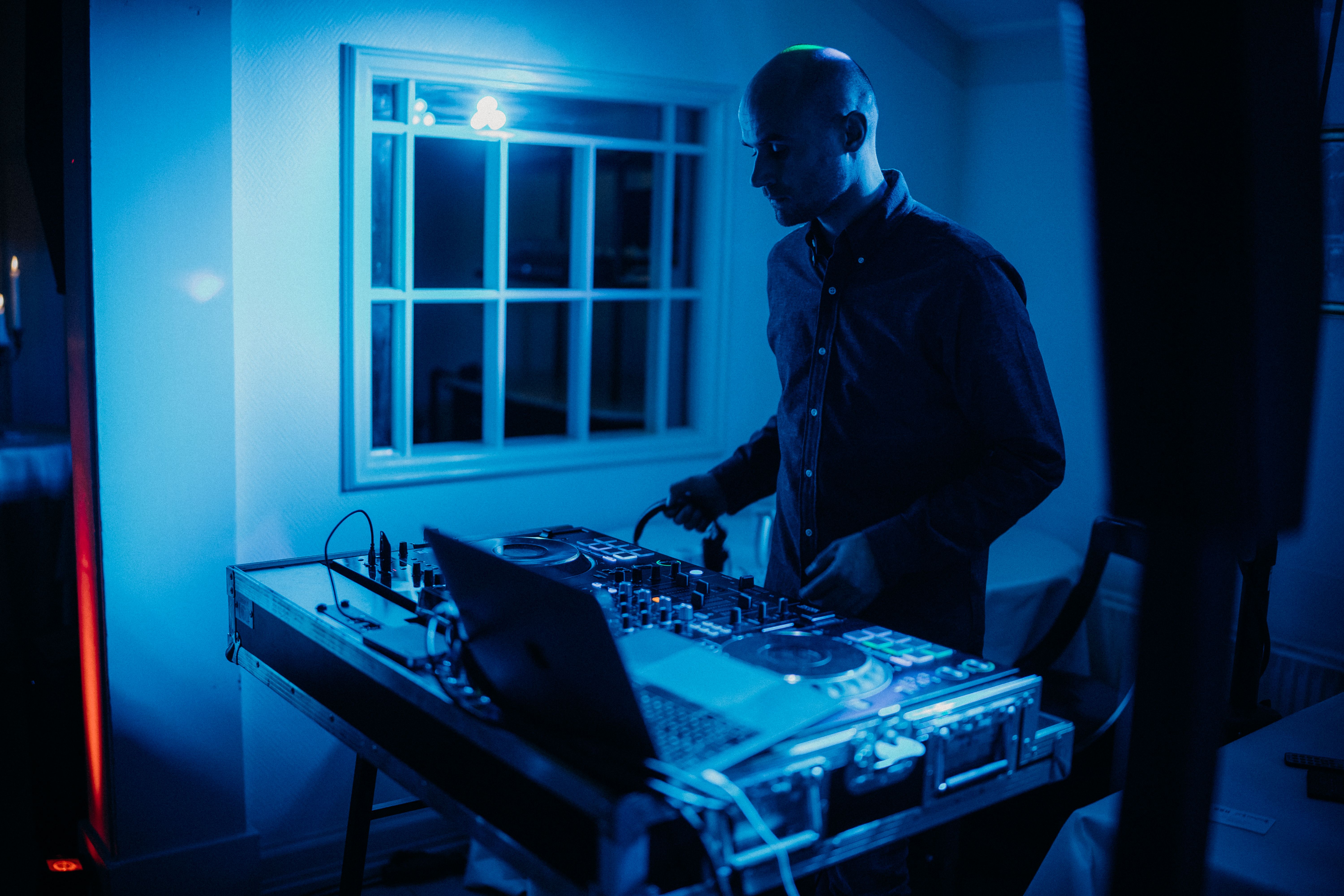 Person in Black Leather Jacket Playing Dj Mixer · Free Stock Photo