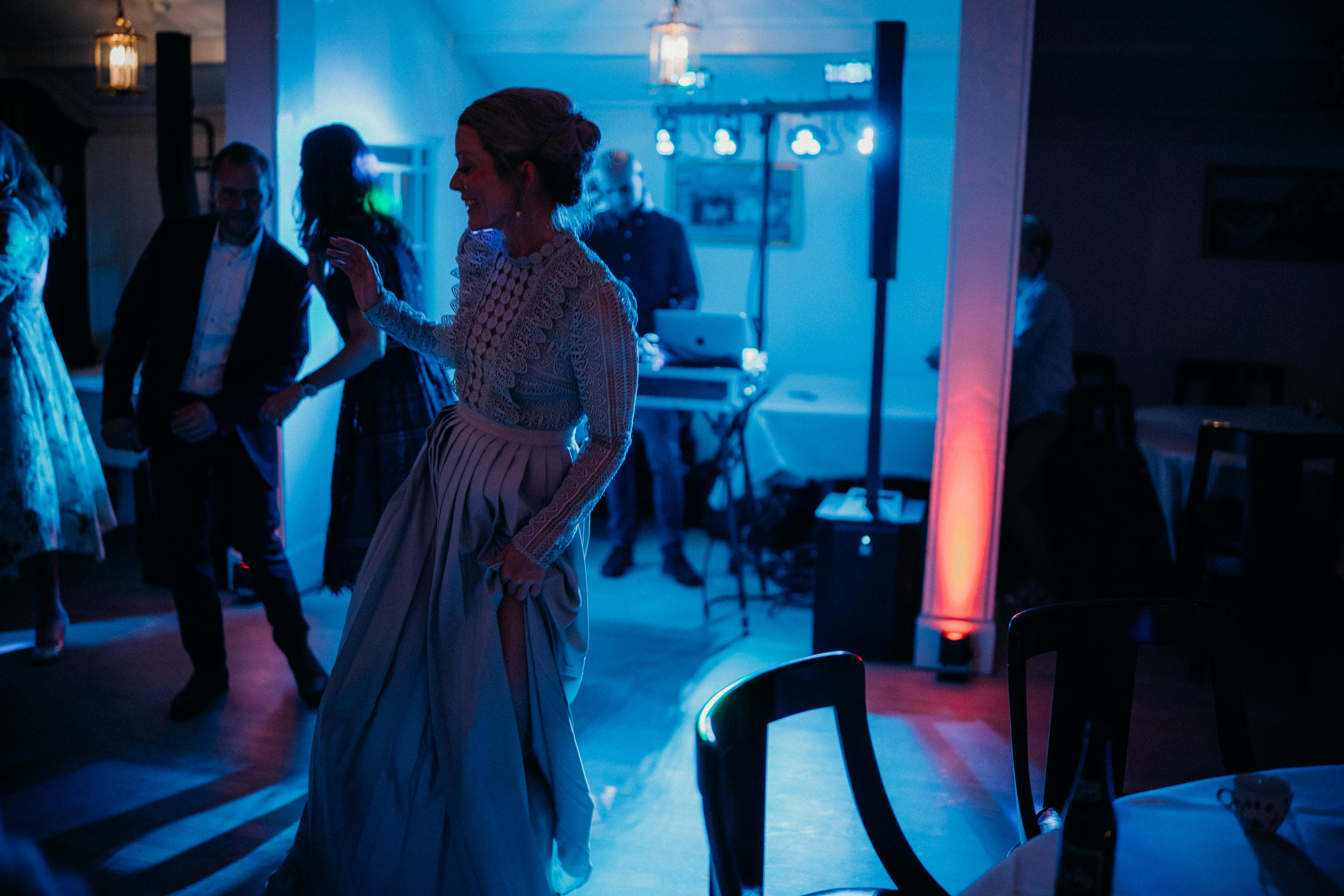Woman Wearing a Gray Dress Dancing · Free Stock Photo