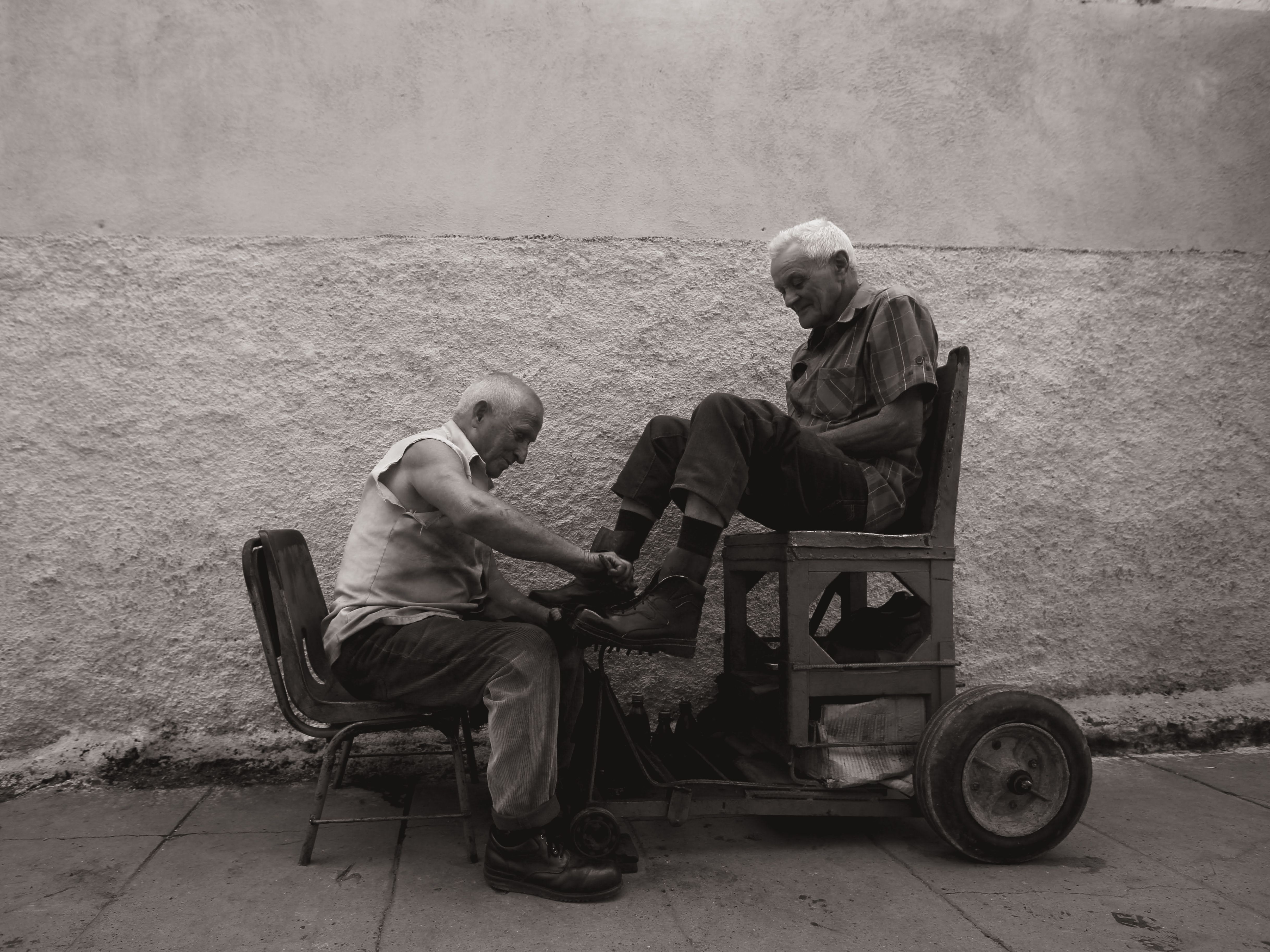 Man Working as Shoeshiner · Free Stock Photo
