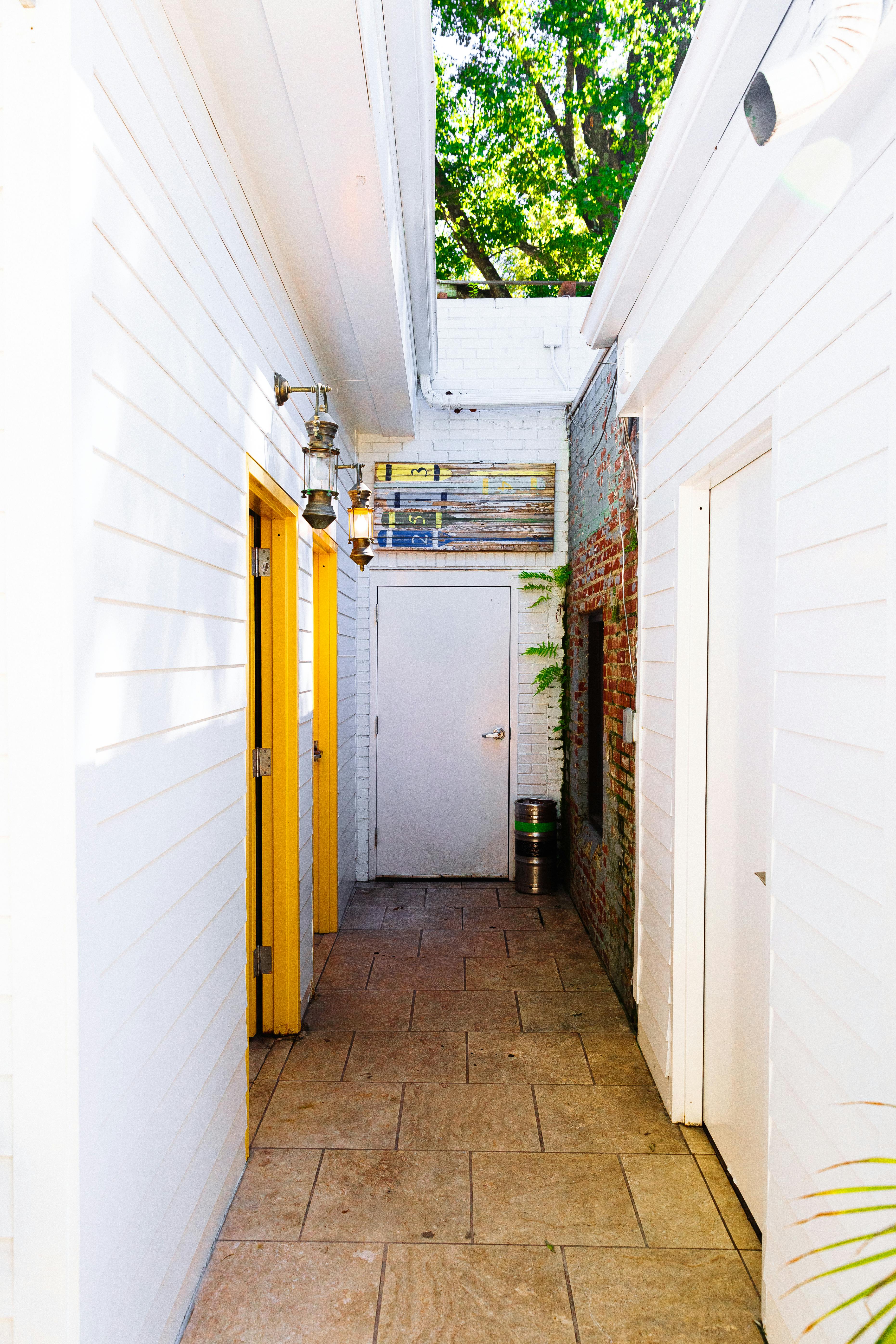 Doors on a Narrow Hallway · Free Stock Photo
