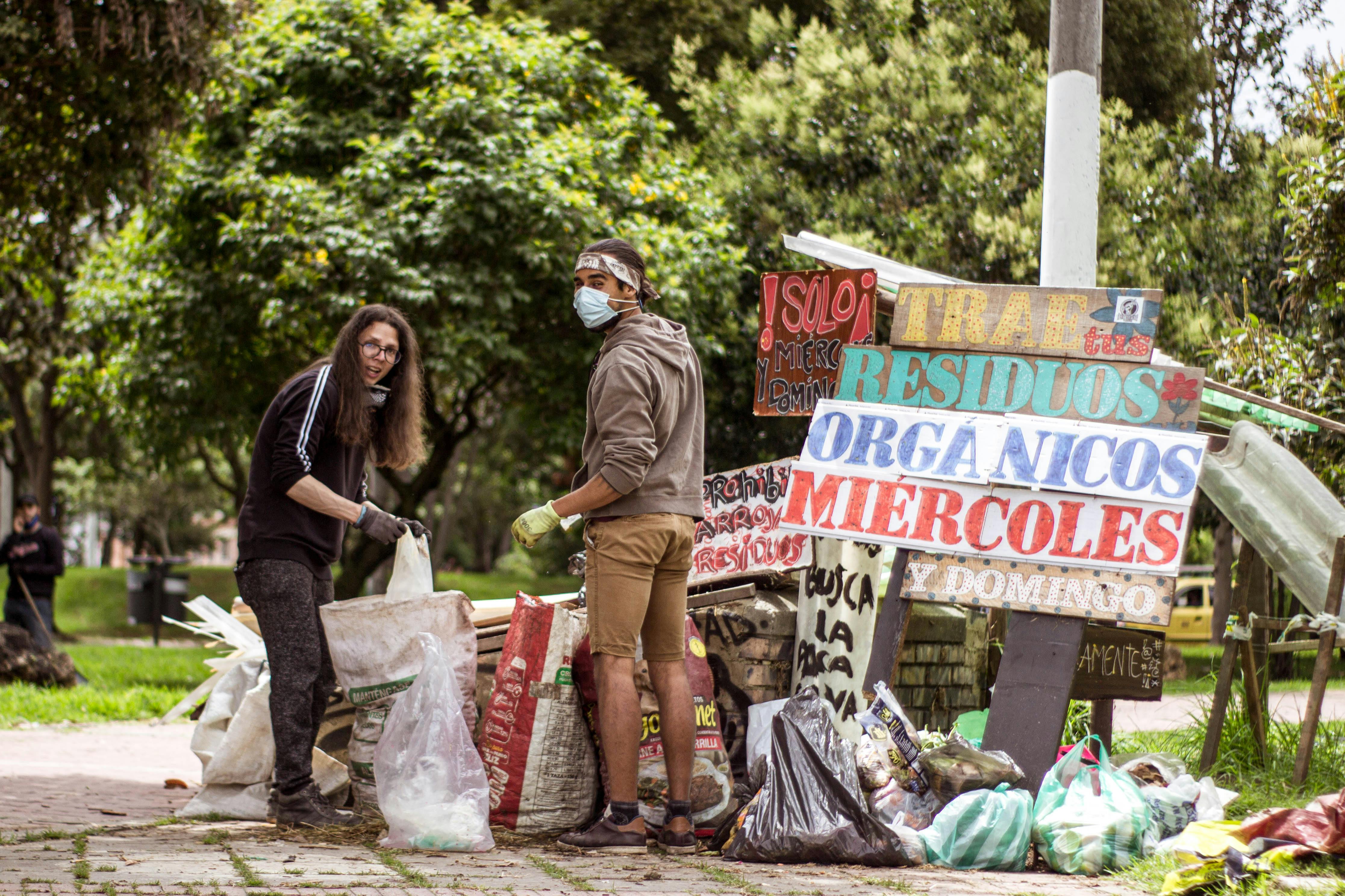 Men Cleaning Out Trash · Free Stock Photo